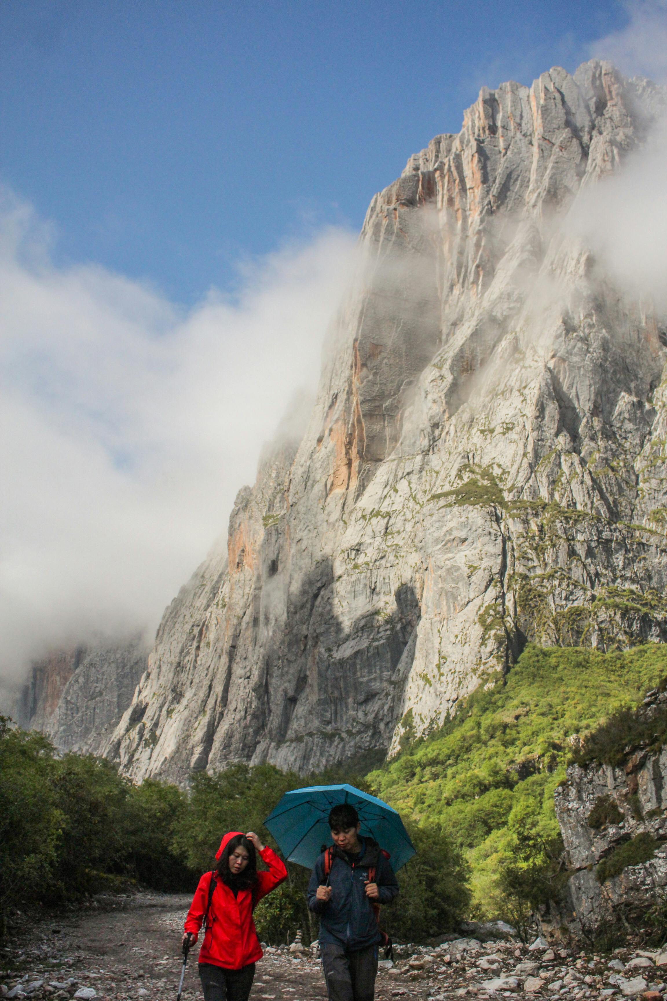 Woman with Backpack and Torch Exploring Cave · Free Stock Photo