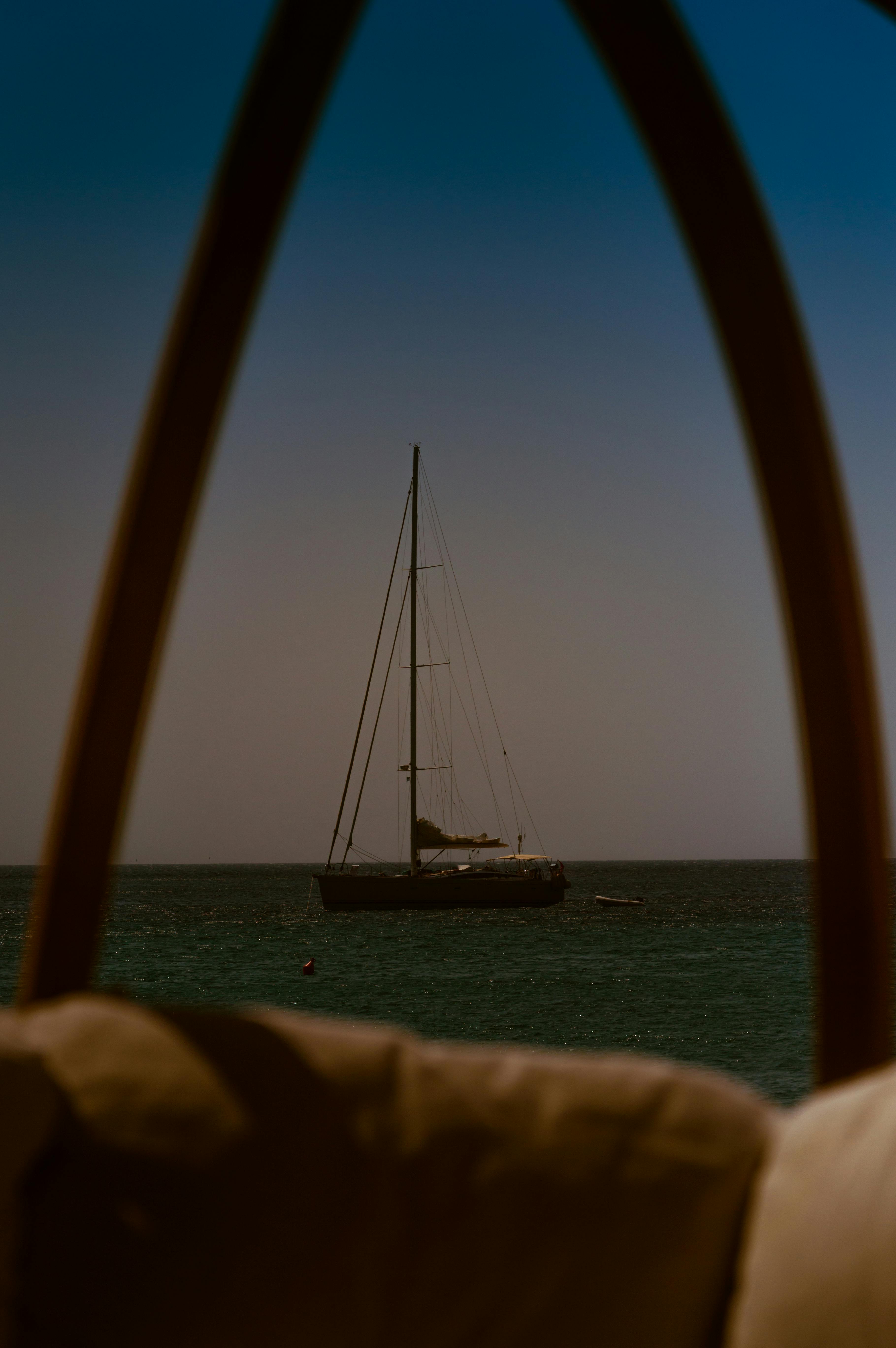 Sailboat at Sea under a Blue Sky · Free Stock Photo
