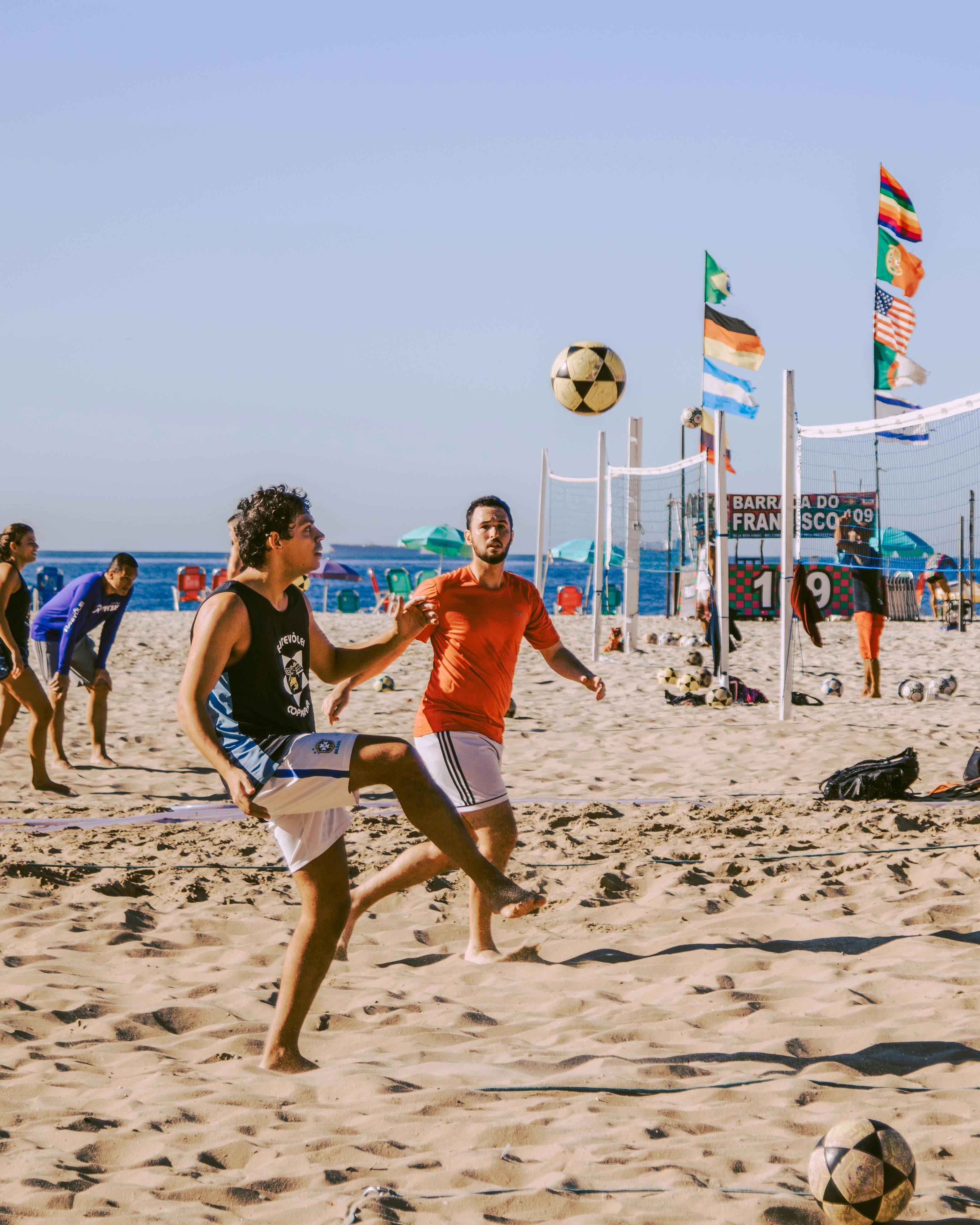 Man Playing with Ball on Beach · Free Stock Photo