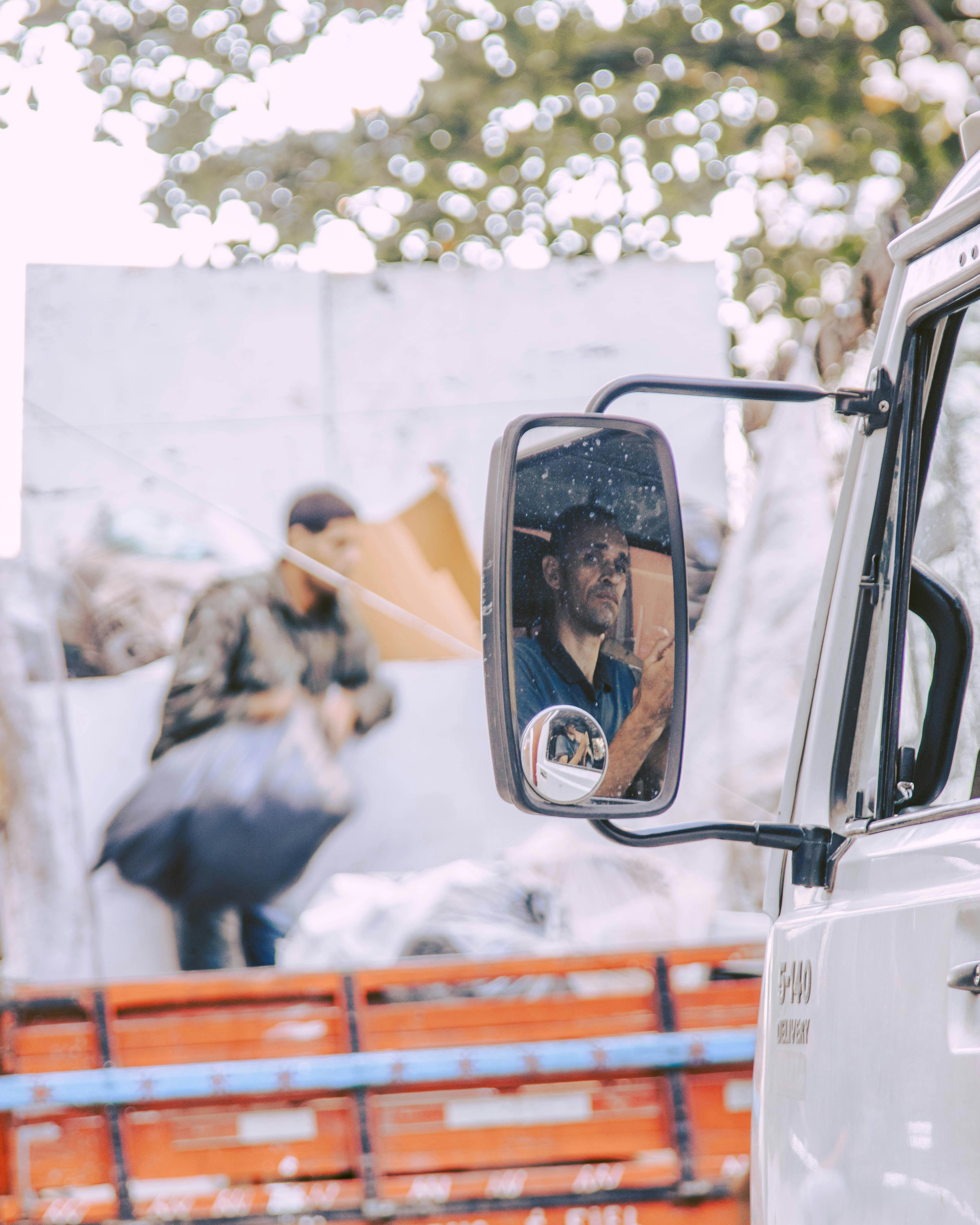 Side Mirror Reflection of Road on Car · Free Stock Photo
