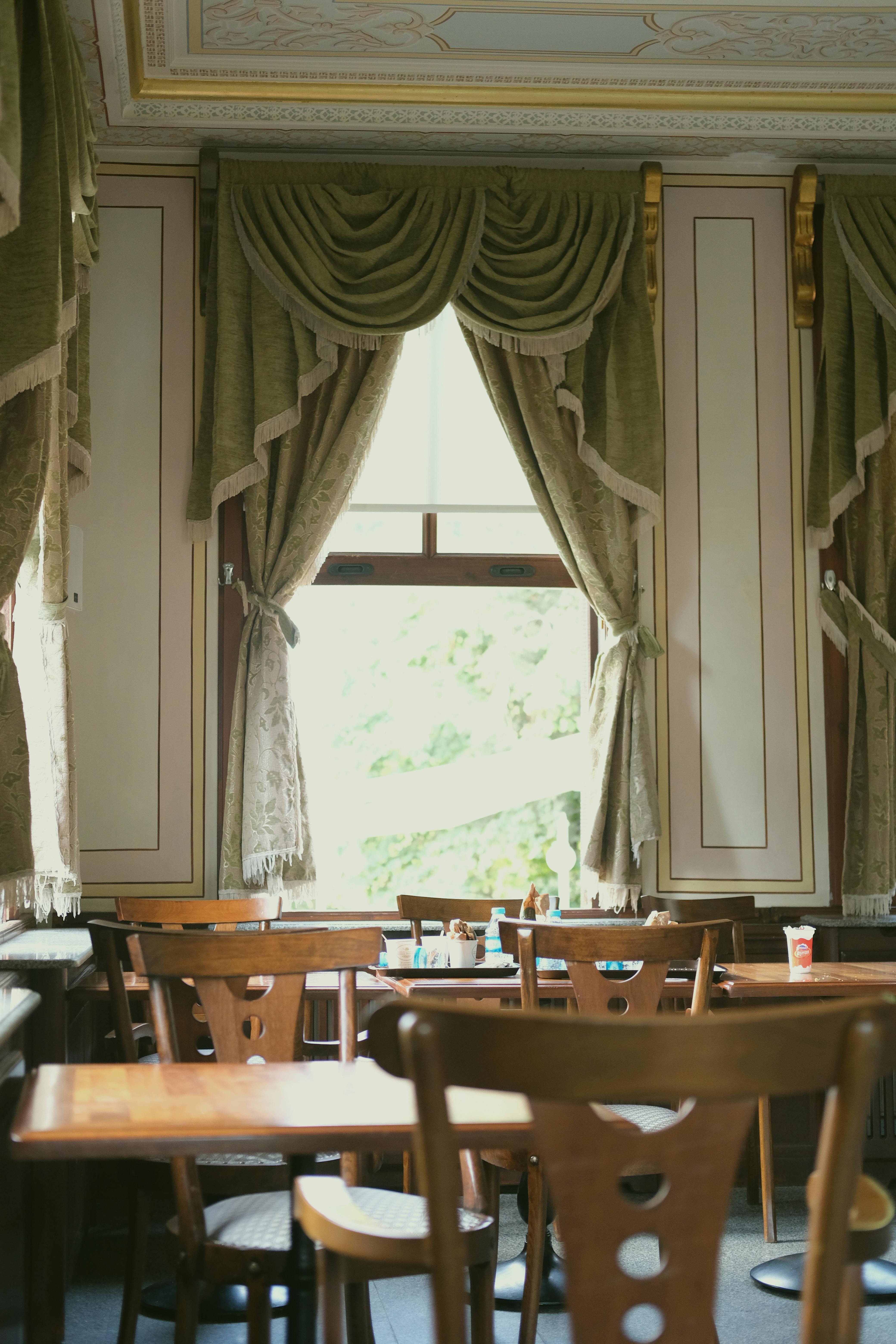Photograph of Wooden Tables and Chairs Inside a Restaurant · Free Stock ...