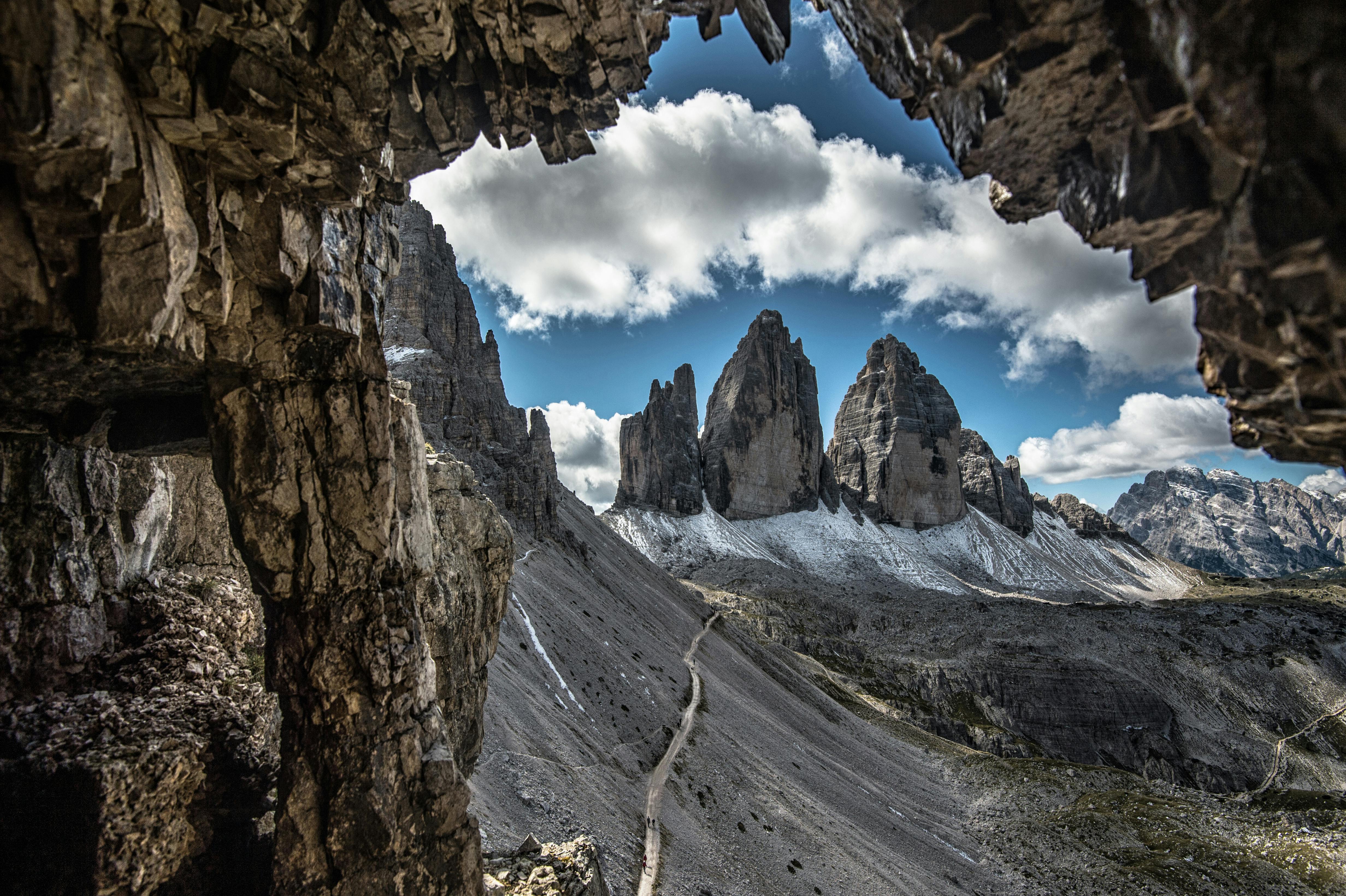 Gray Rocky Mountains Under White Clouds · Free Stock Photo