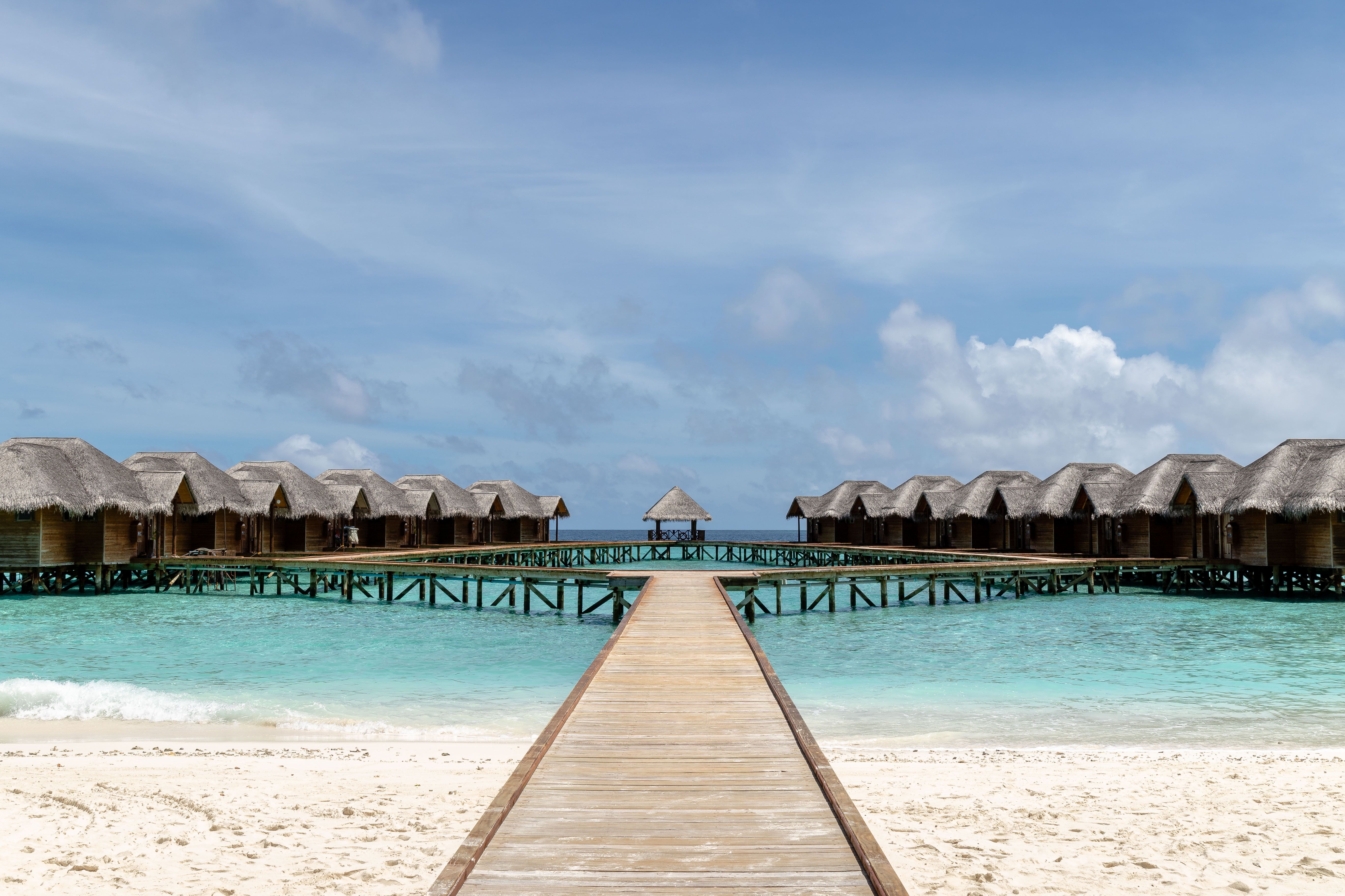 Brown Wooden Hut on Blue Sea Water · Free Stock Photo