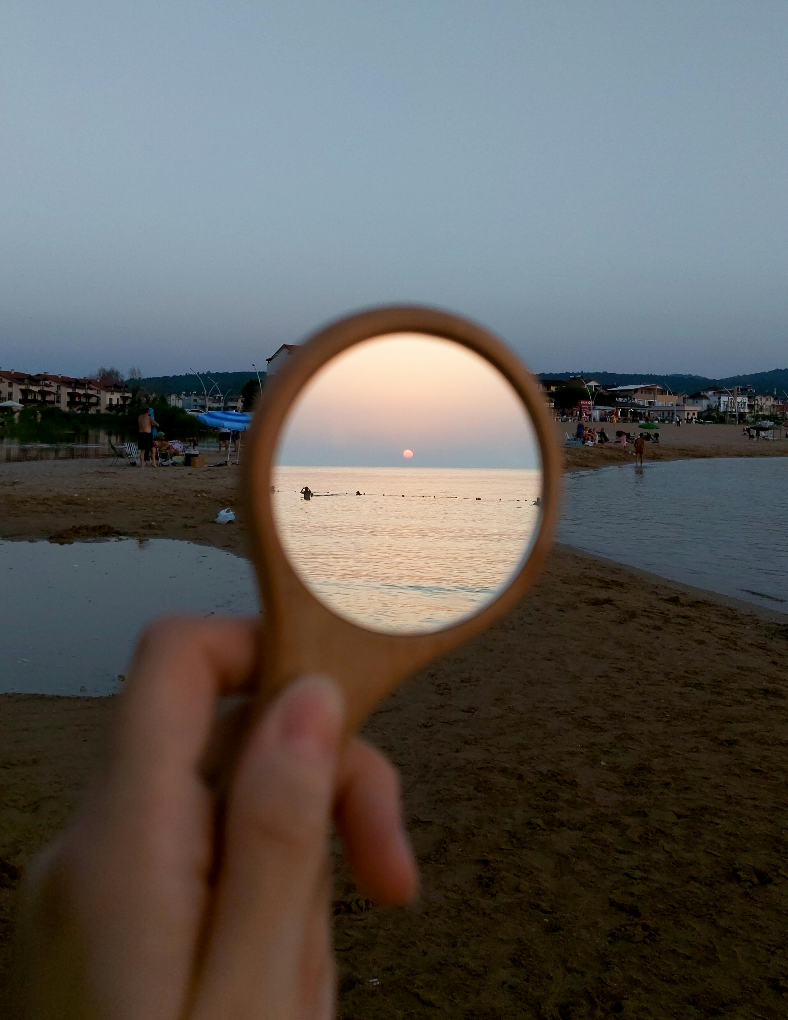 A Woman Holding a Mirror · Free Stock Photo