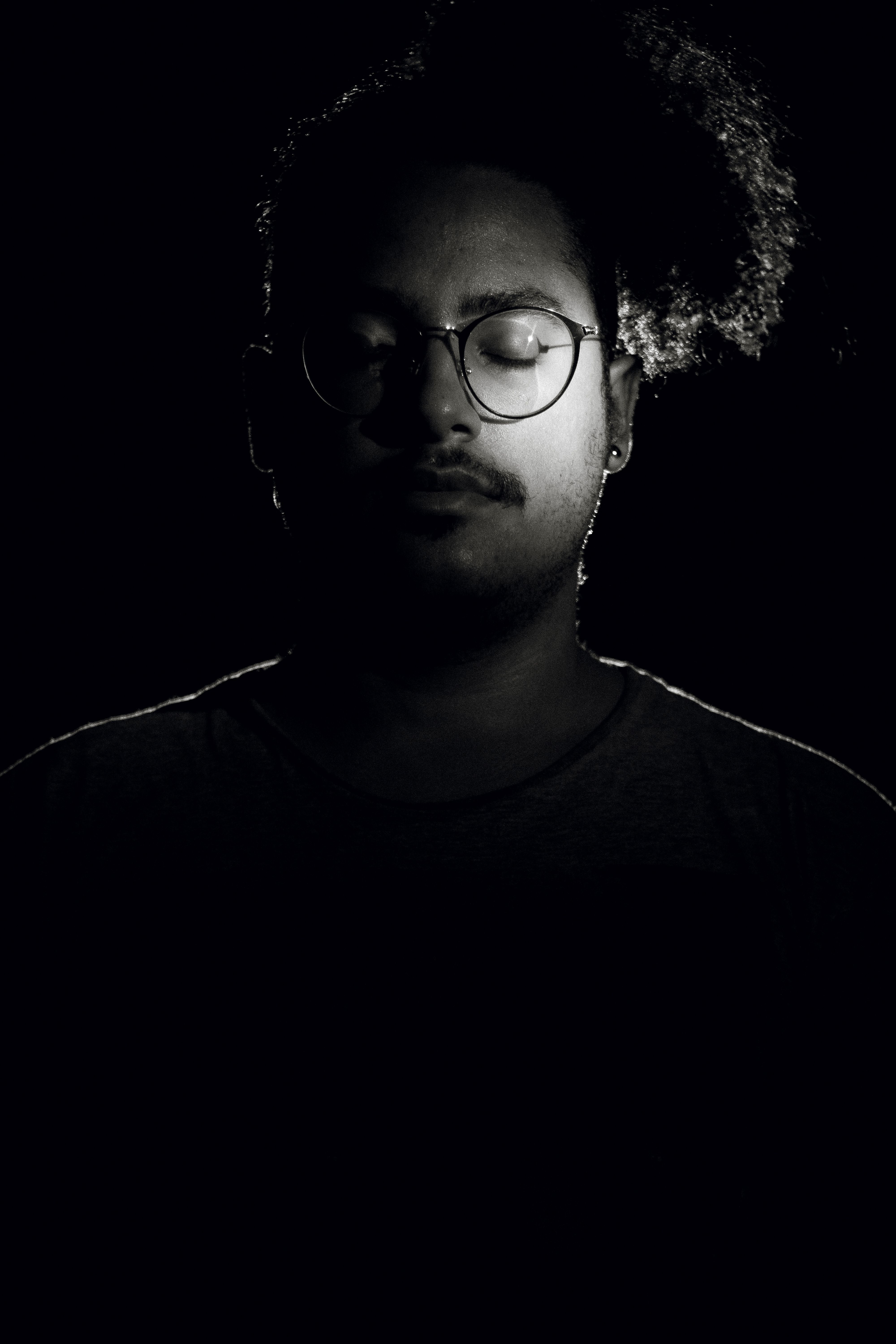 A Man Standing Still with His Eyes Closed · Free Stock Photo