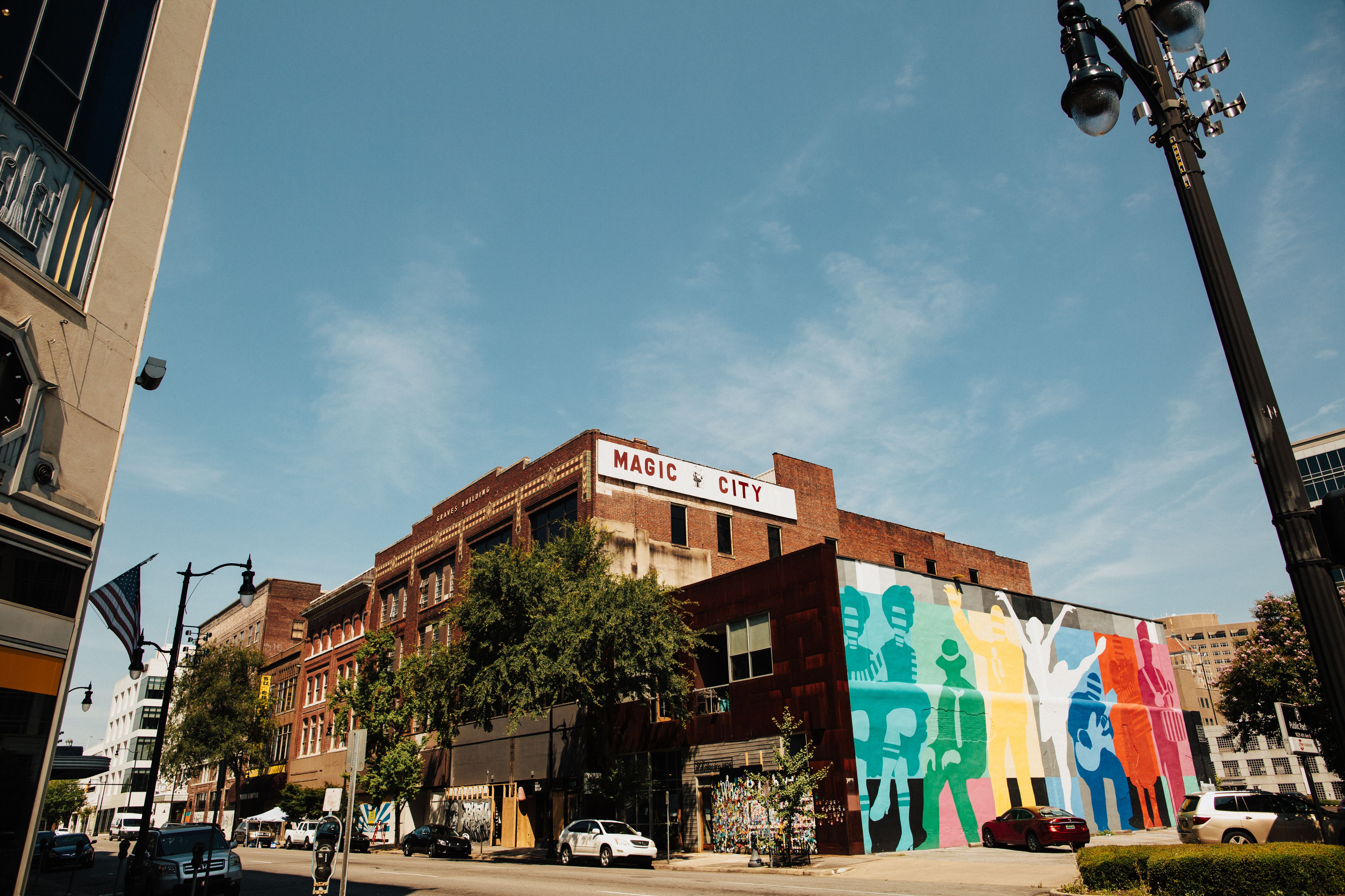 Photo of the Building with a Mural on the Wall · Free Stock Photo