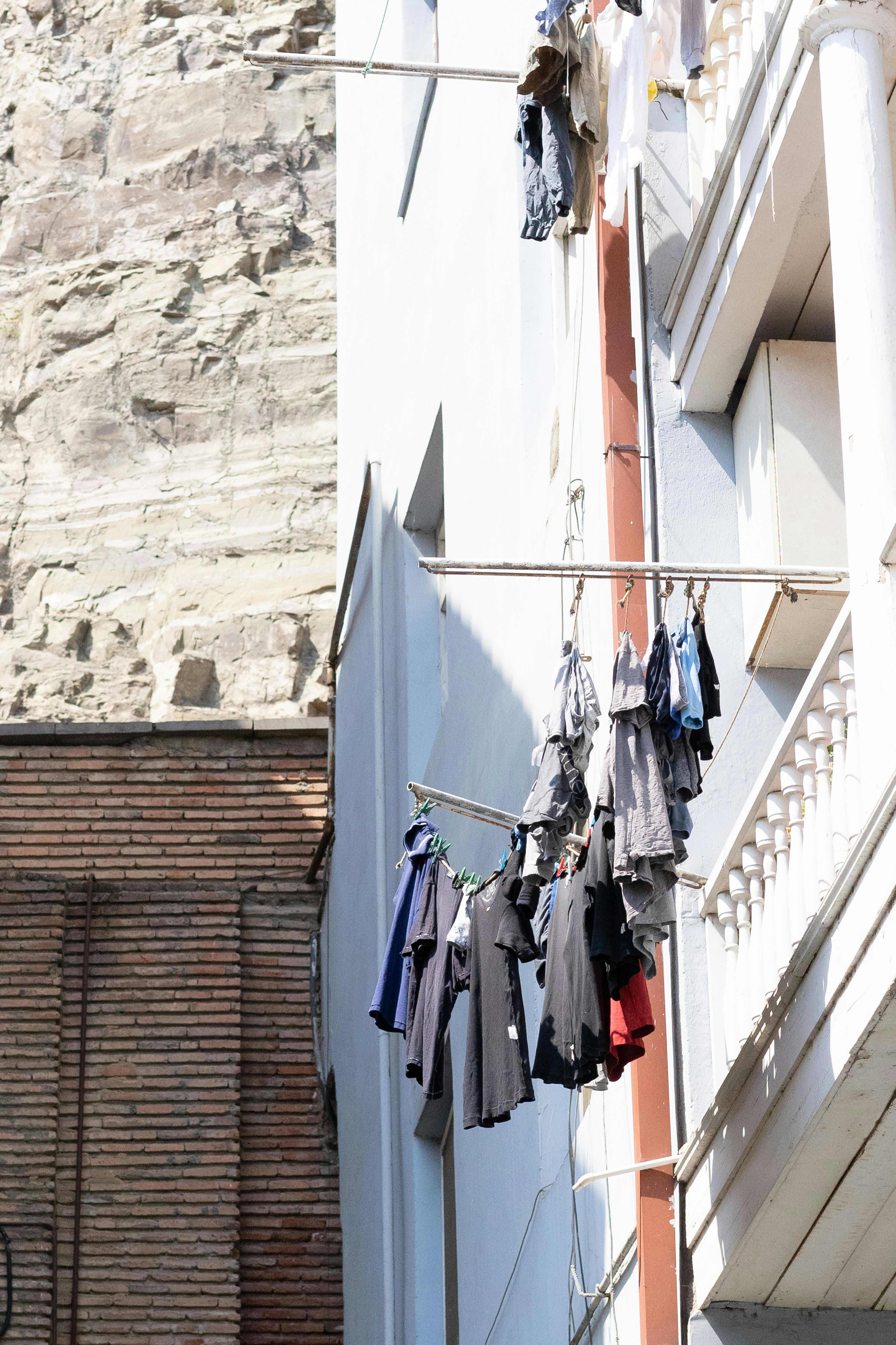 Clothes Hanging on Clothes Line on Balconies · Free Stock Photo