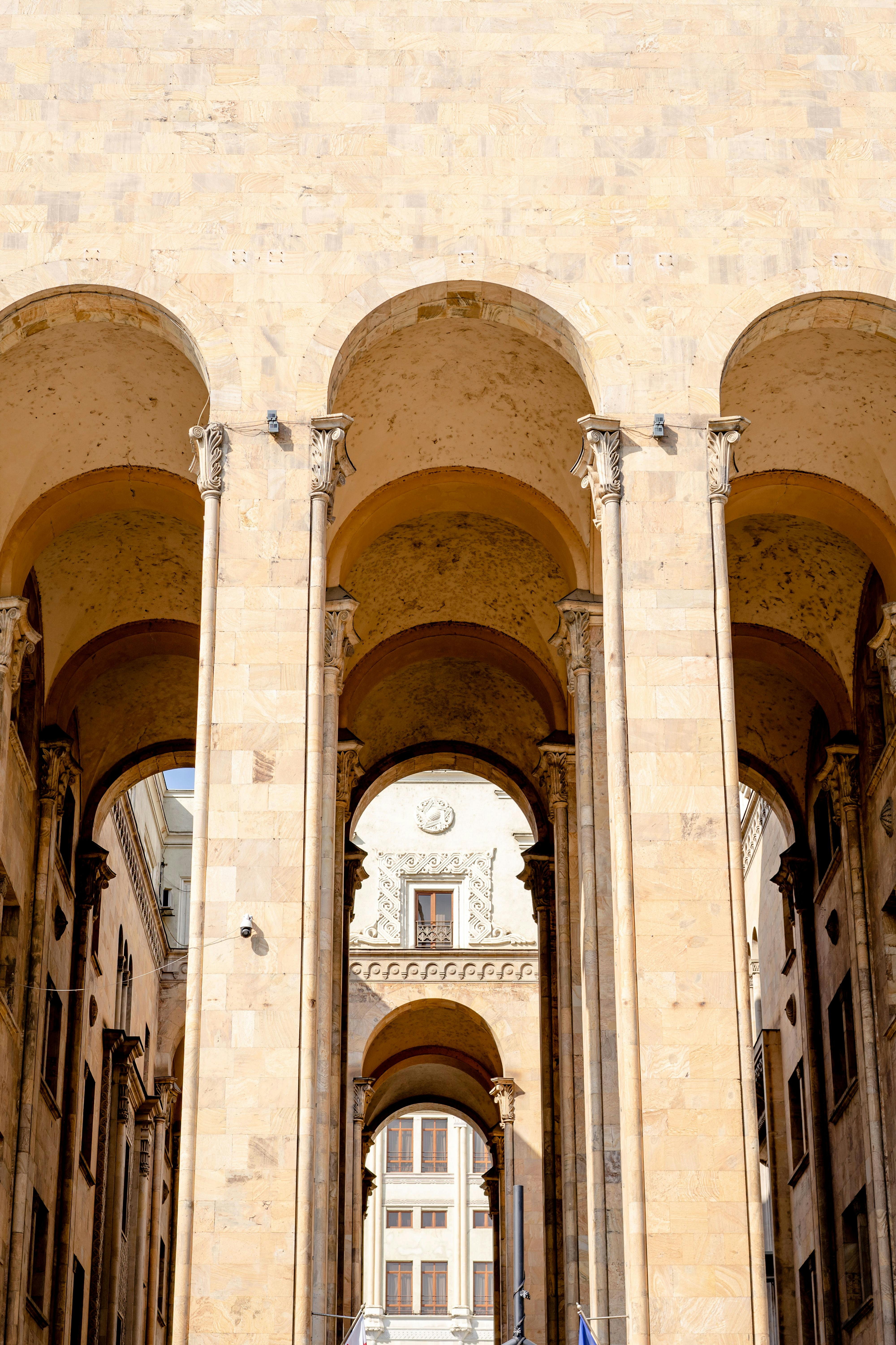 Arched Columns Entrance to a Building Square · Free Stock Photo