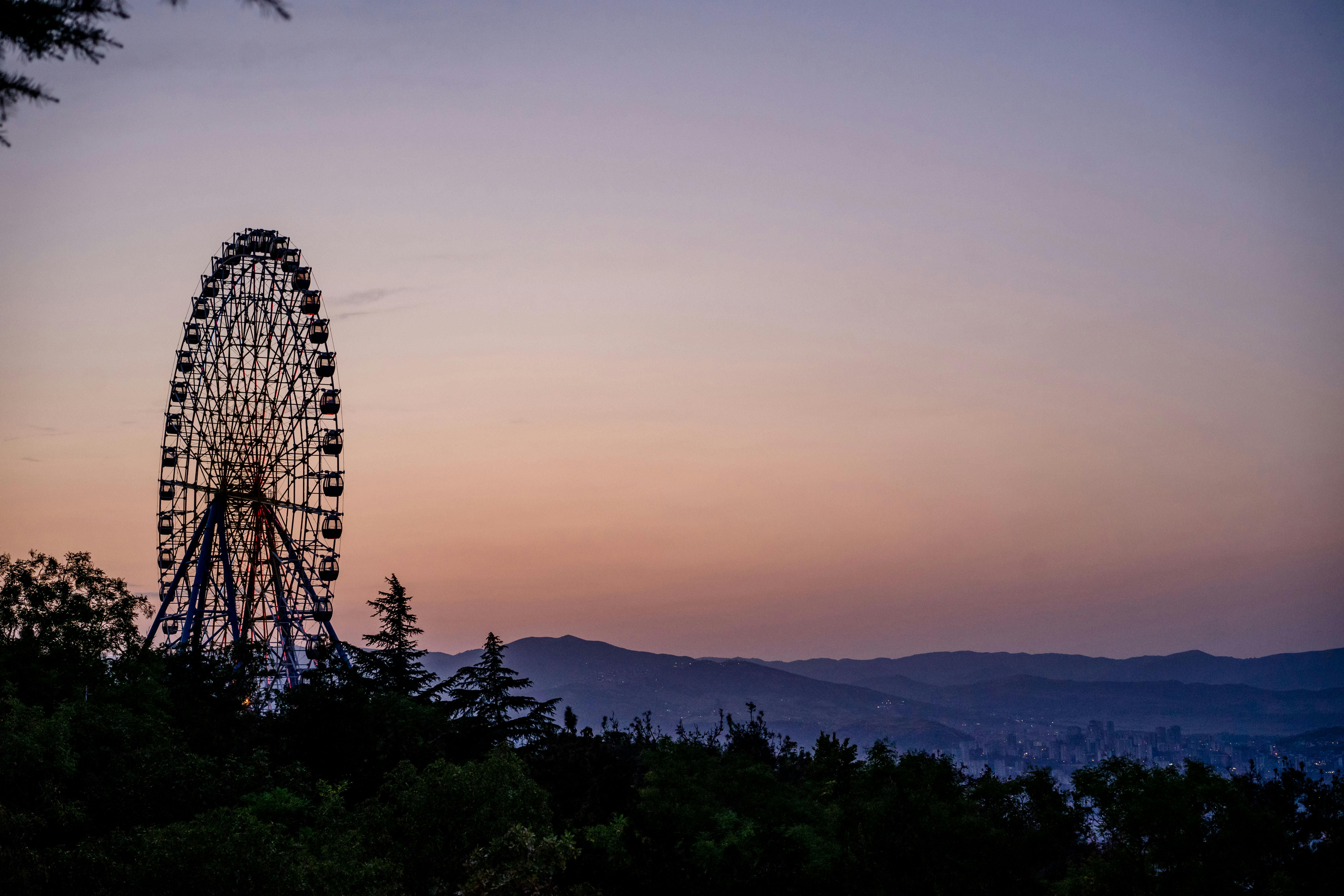Observation Wheel over the Hill · Free Stock Photo
