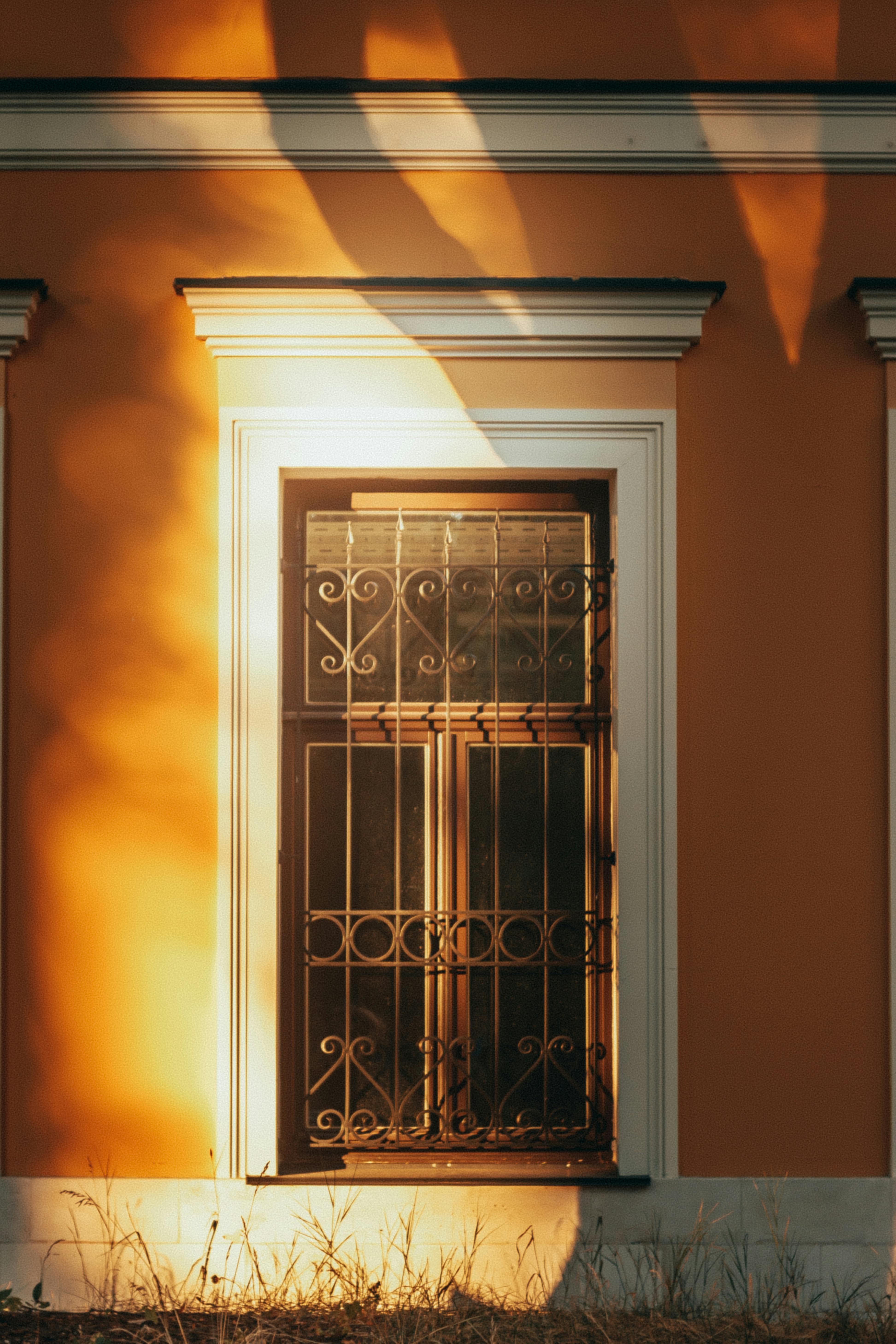 A Window with a Metal Railing · Free Stock Photo