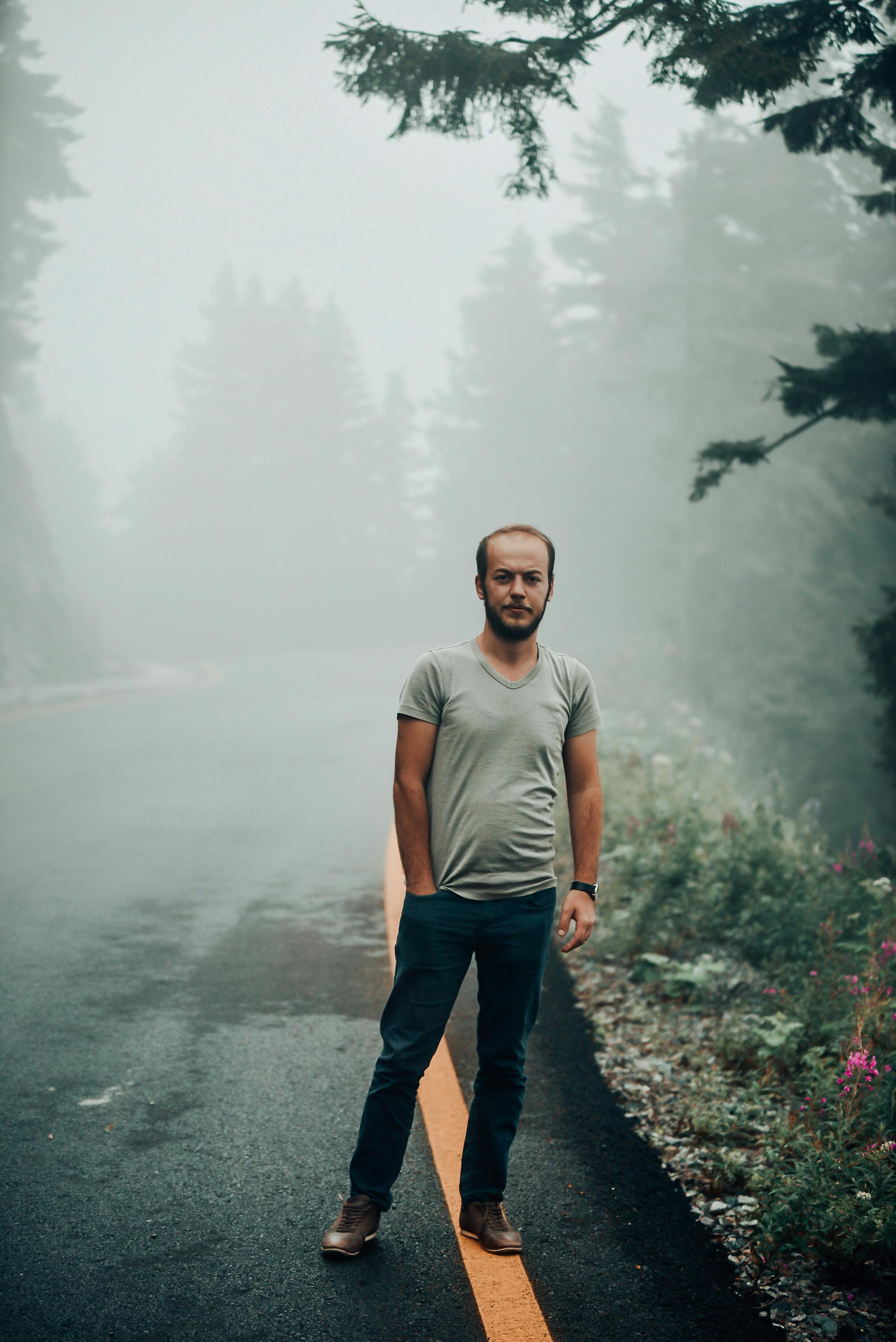 Spooky Man Standing on a Foggy Hill · Free Stock Photo