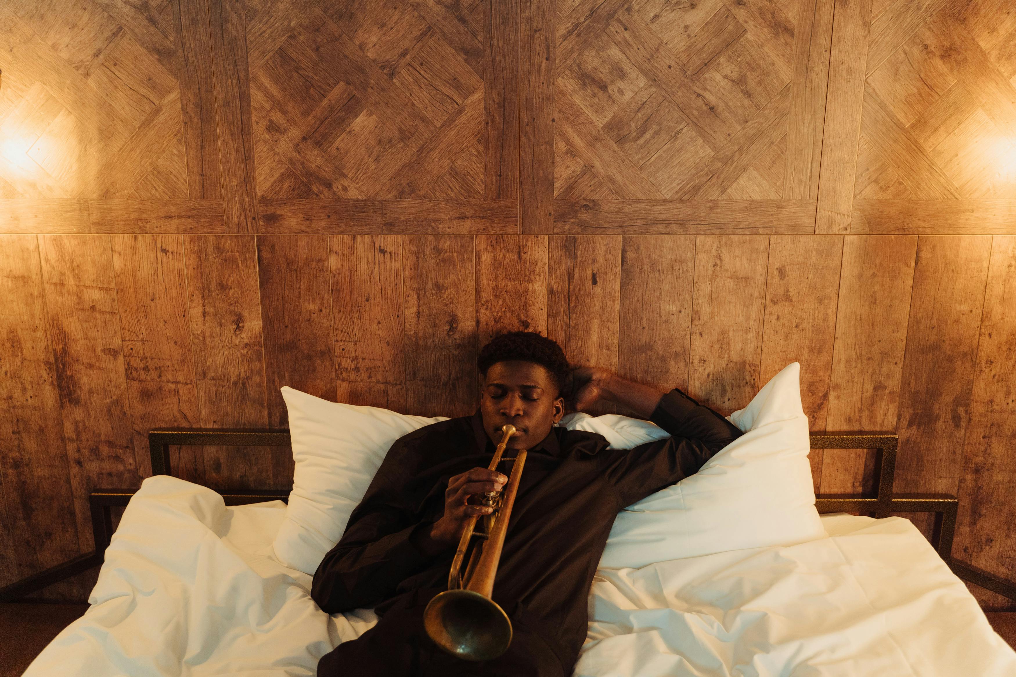 Man Playing Brass Instrument during Daytime · Free Stock Photo