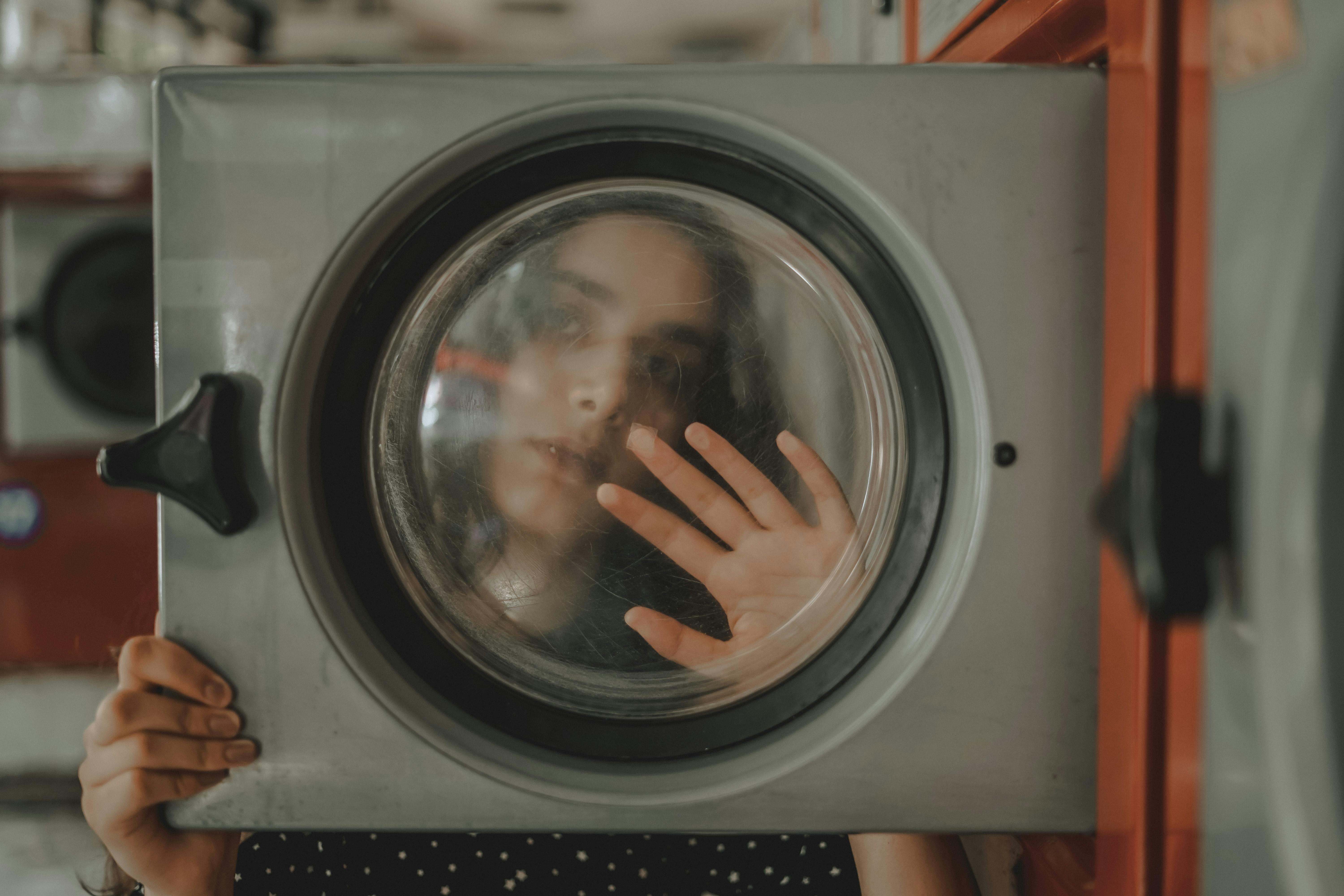 Woman behind Microwaves Window · Free Stock Photo
