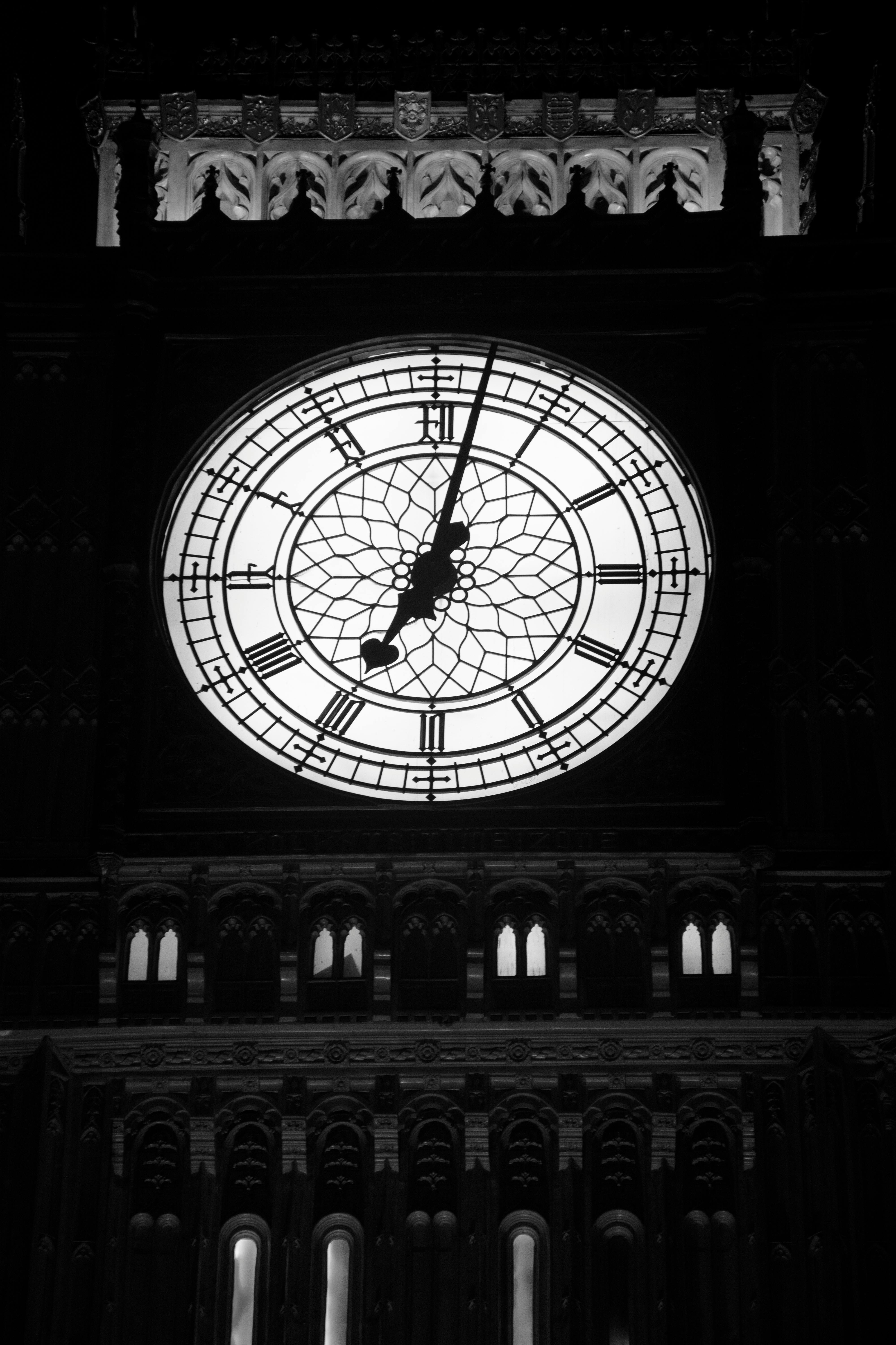 Illuminated Clock on a Building · Free Stock Photo