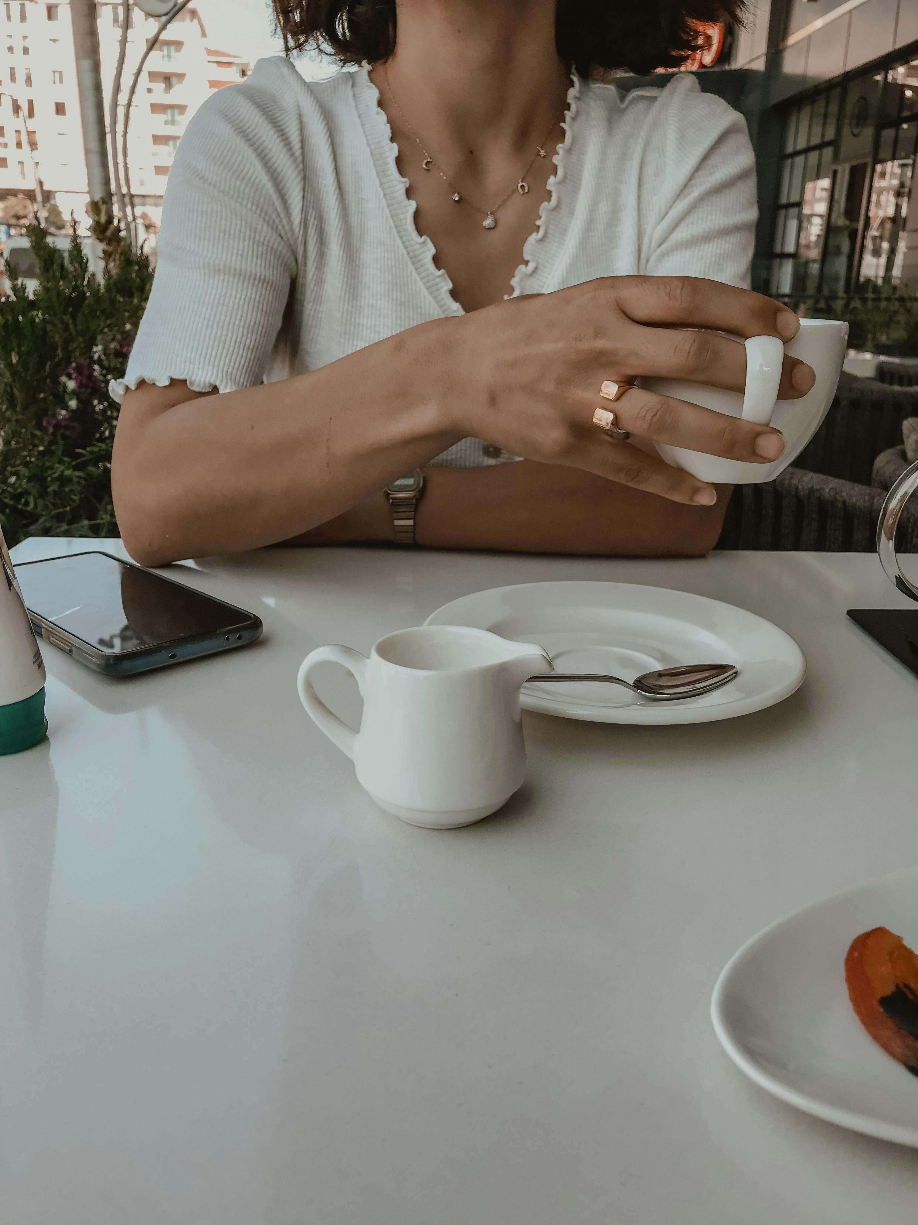 A Person Holding a Ceramic Cup · Free Stock Photo