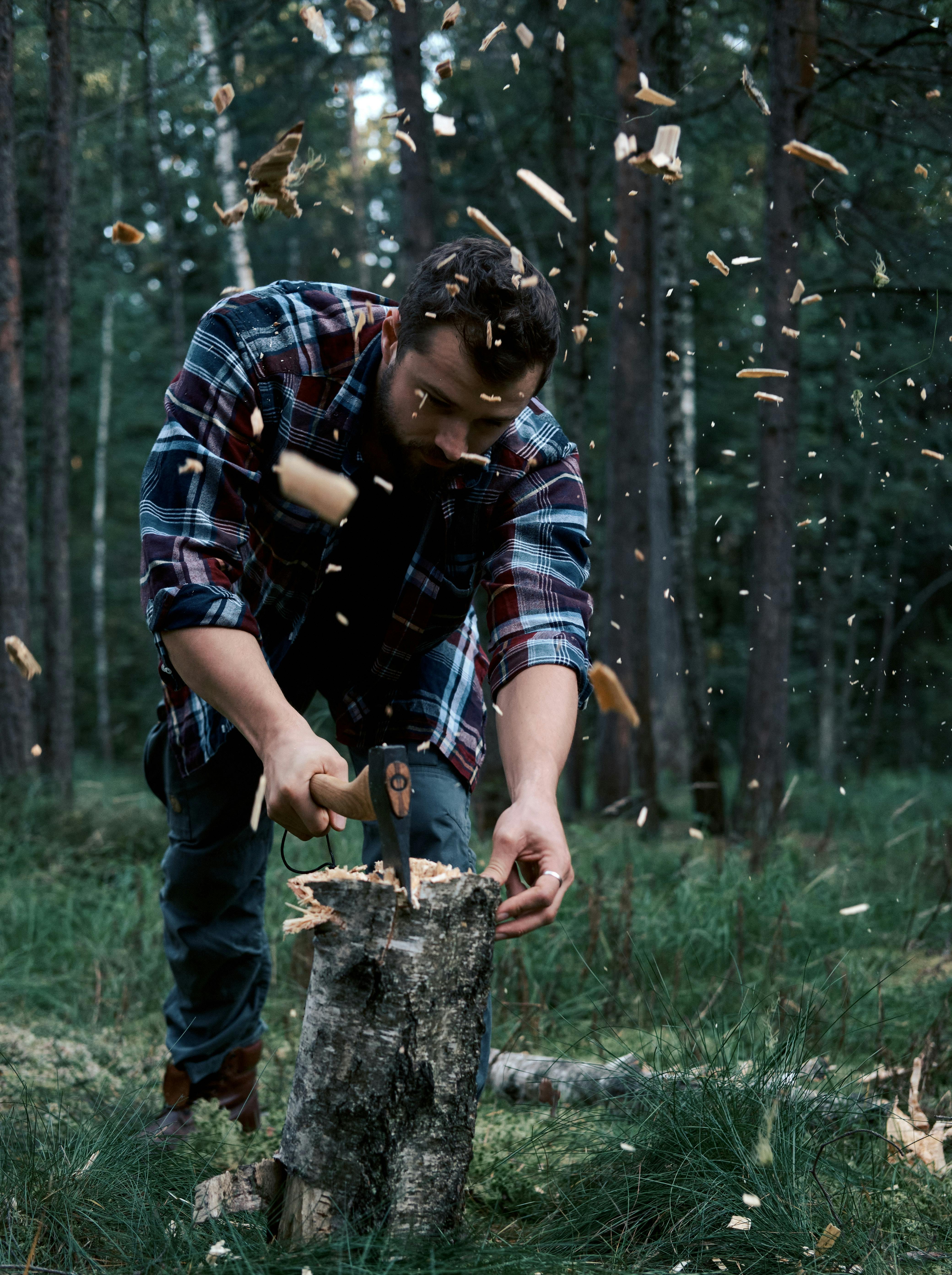 A Man Chopping the Tree using Axe · Free Stock Photo