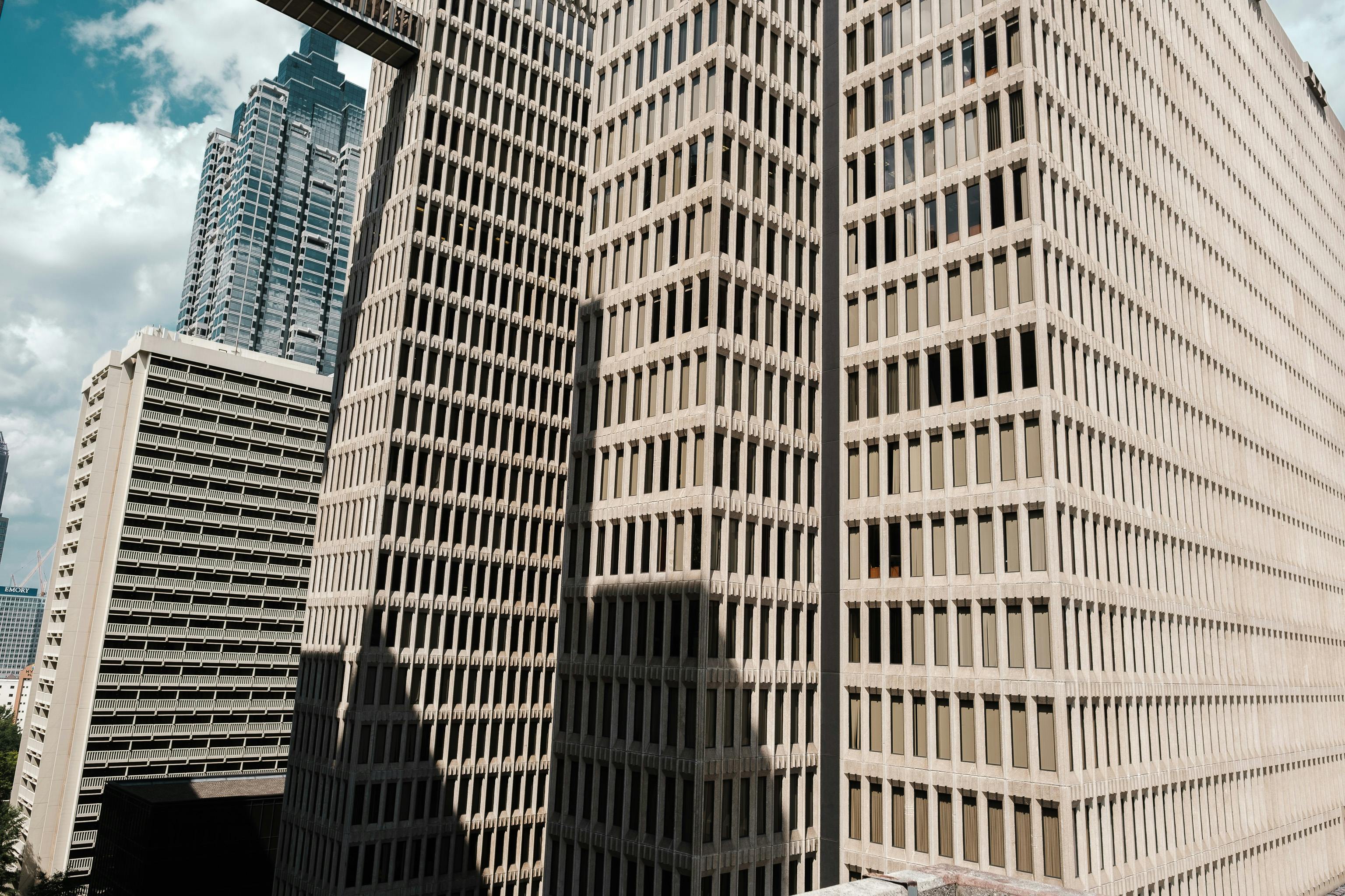 Concrete Buildings with Glass Windows · Free Stock Photo