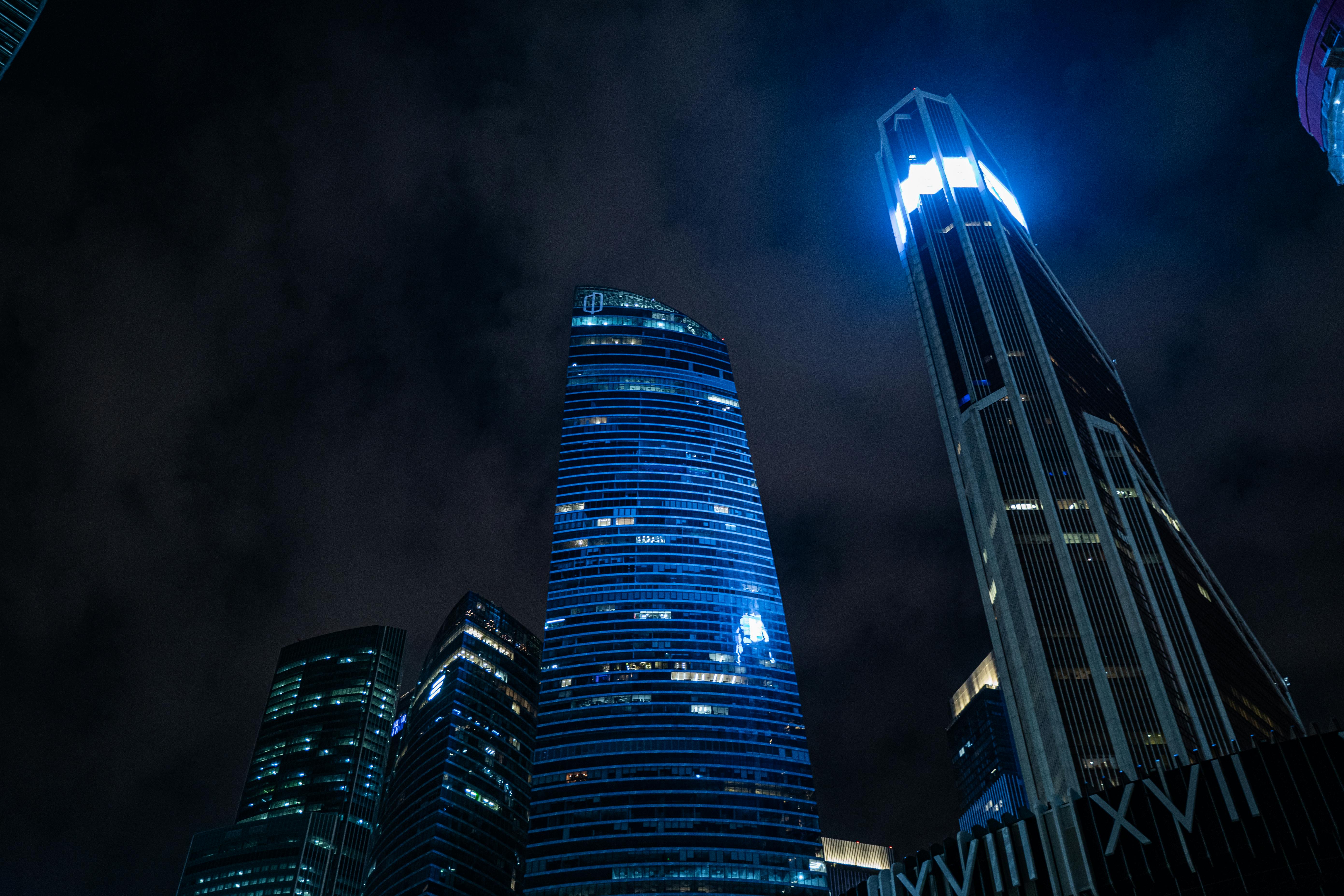 Modern High Rise Buildings During Night Time · Free Stock Photo