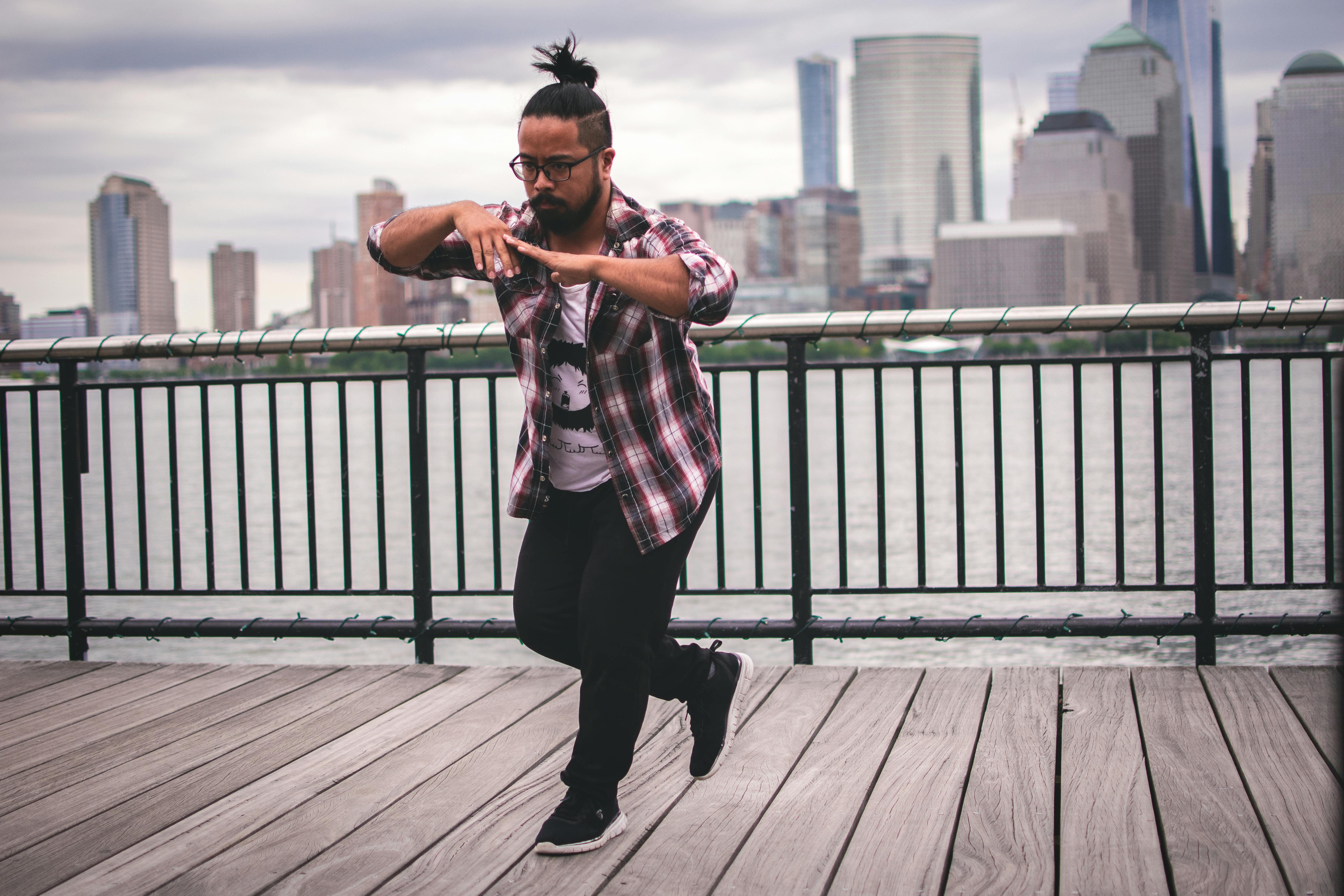 A Man Dancing on the Boardwalk · Free Stock Photo