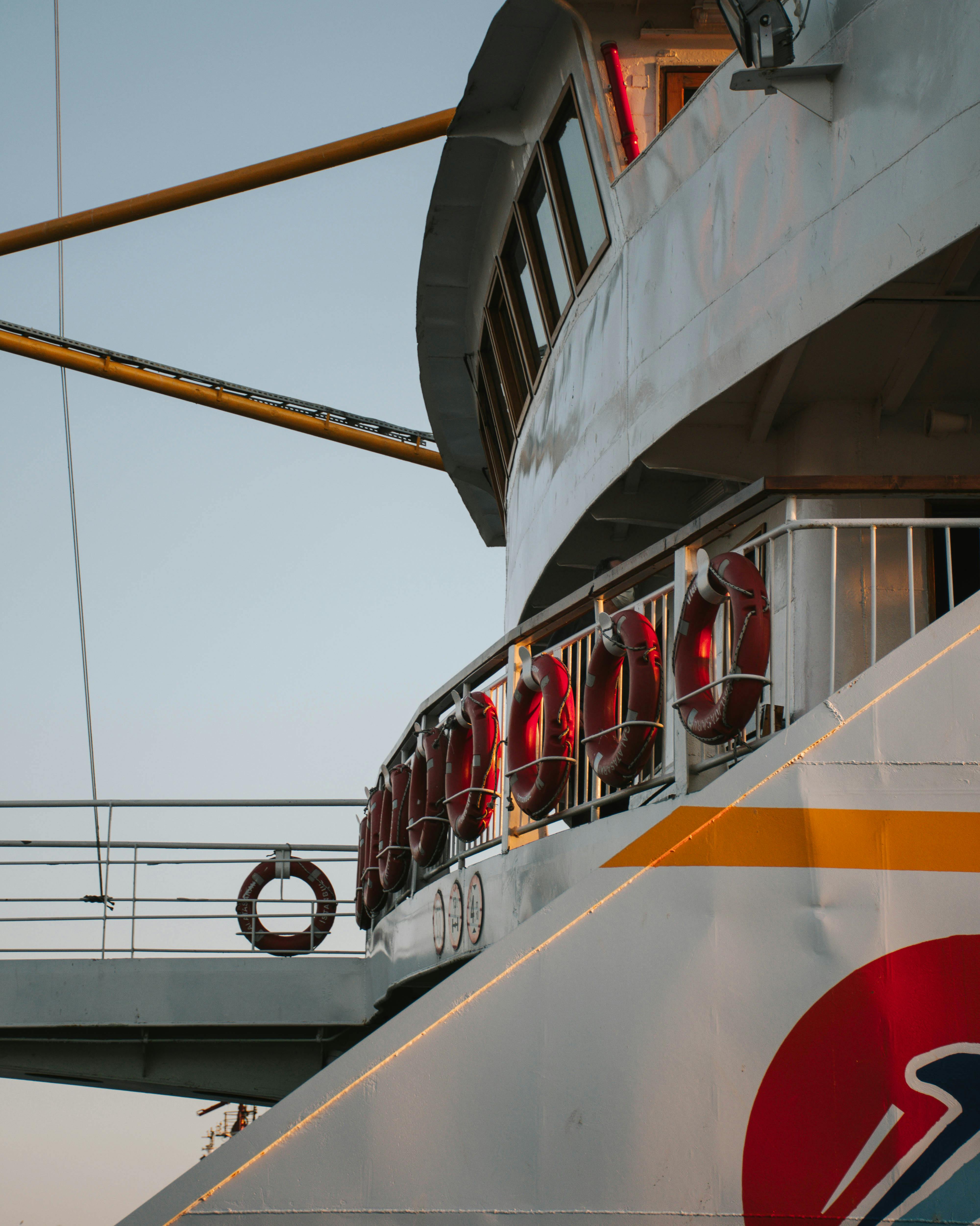 People on Sitting on the Ship Deck · Free Stock Photo