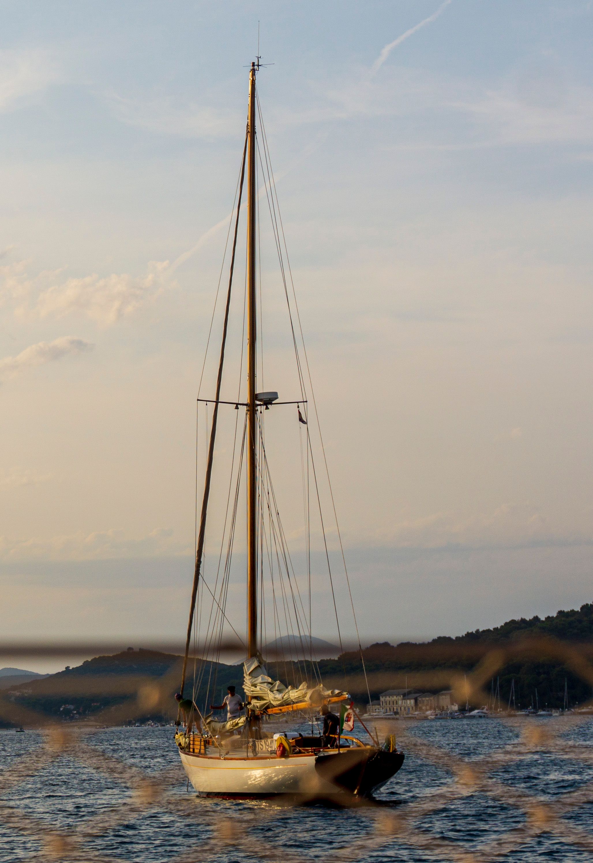 Photograph of an Orange and White Sailboat · Free Stock Photo