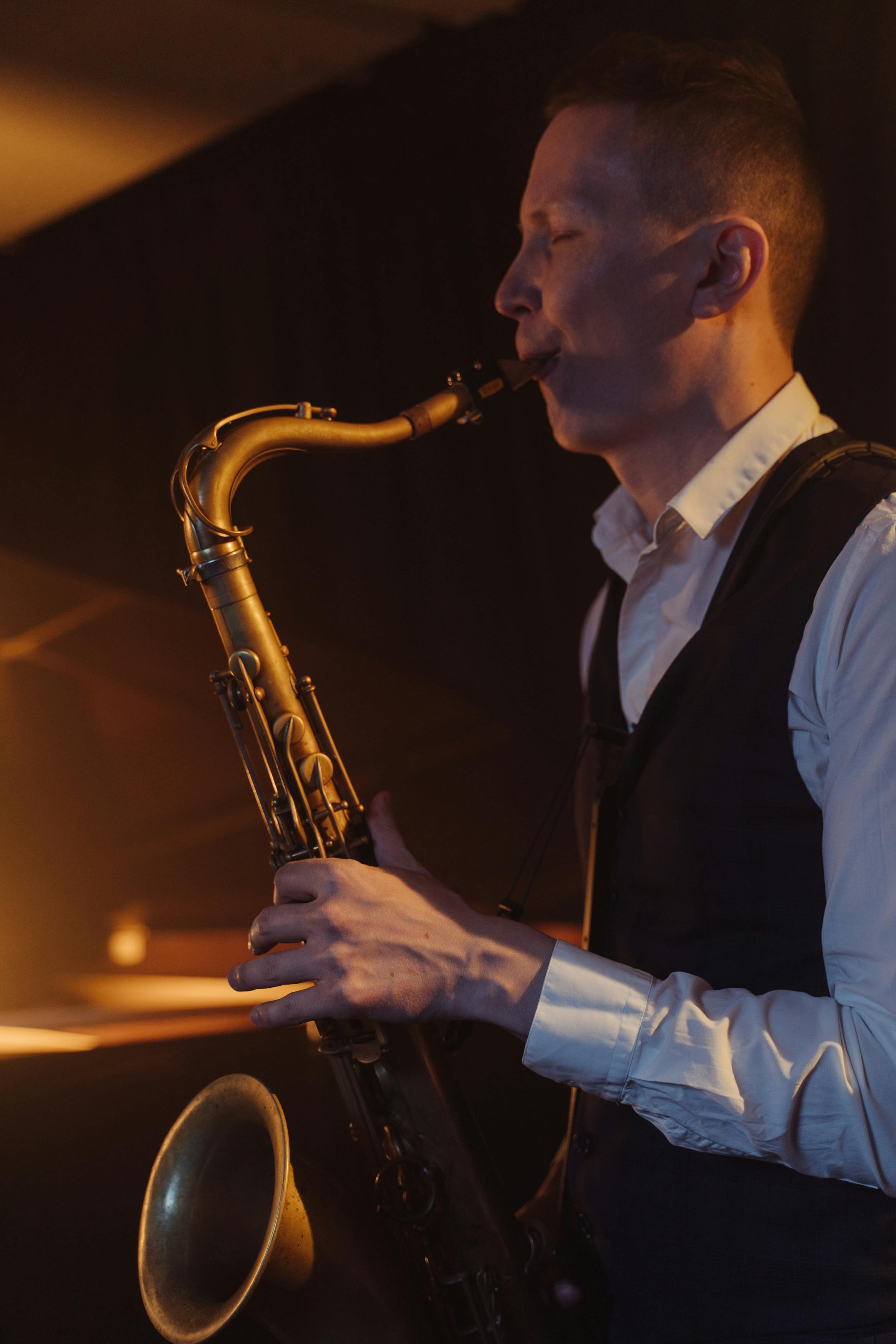 Silhouette of a Man Playing Saxophone during Sunset · Free Stock Photo