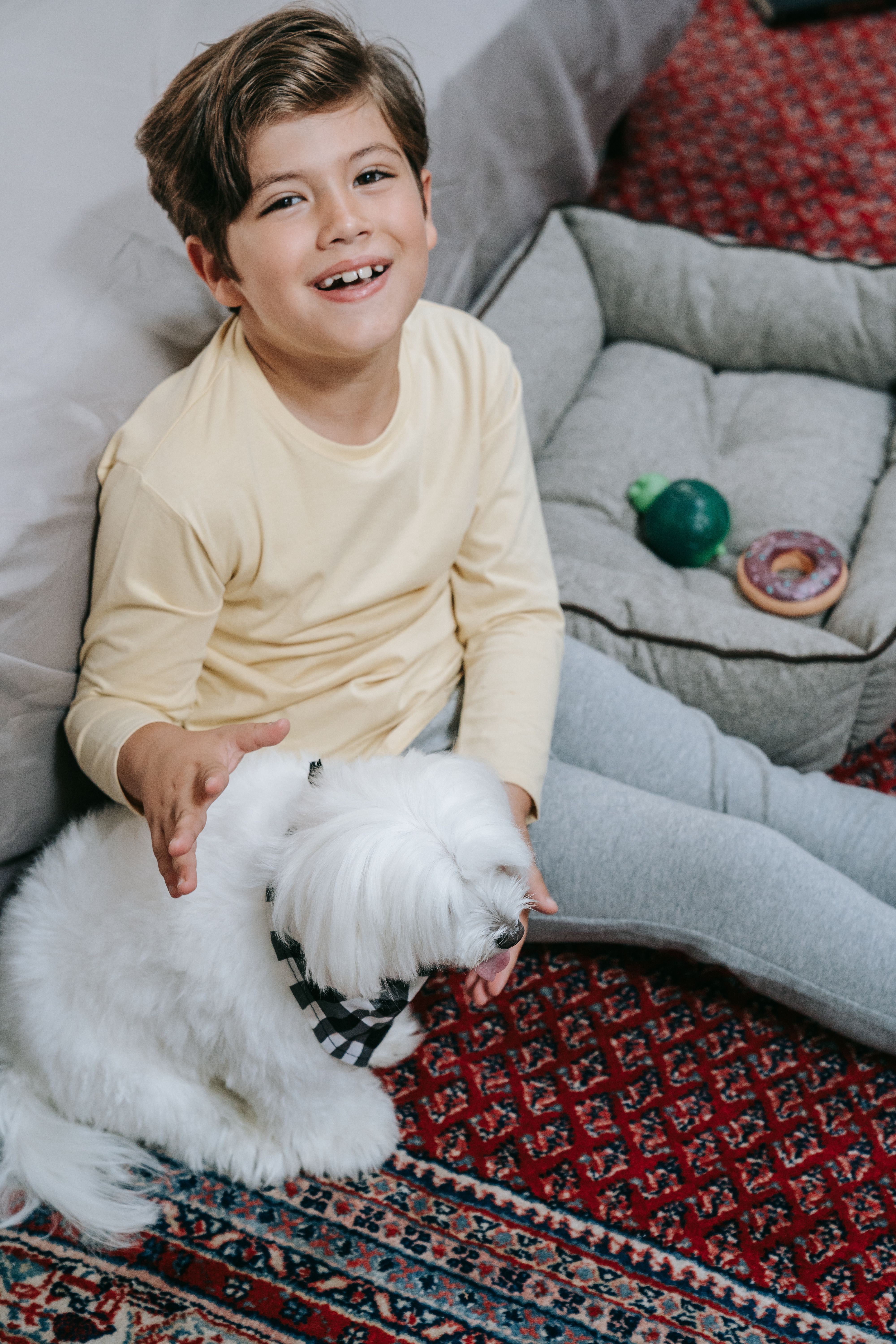 A Cheerful Kid with His Dog · Free Stock Photo