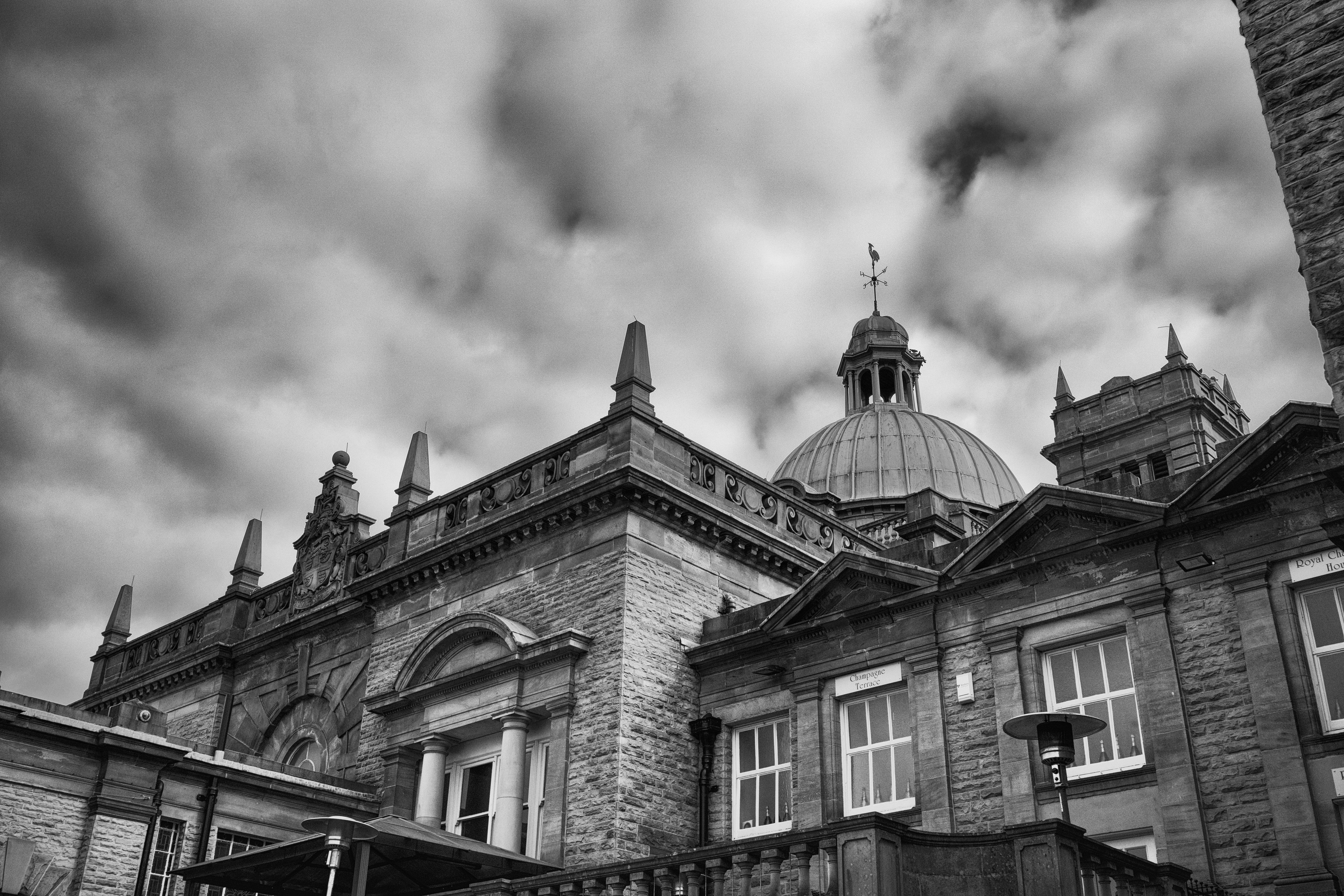 Grayscale Photo of a Concrete Building under the Cloudy Sky · Free ...