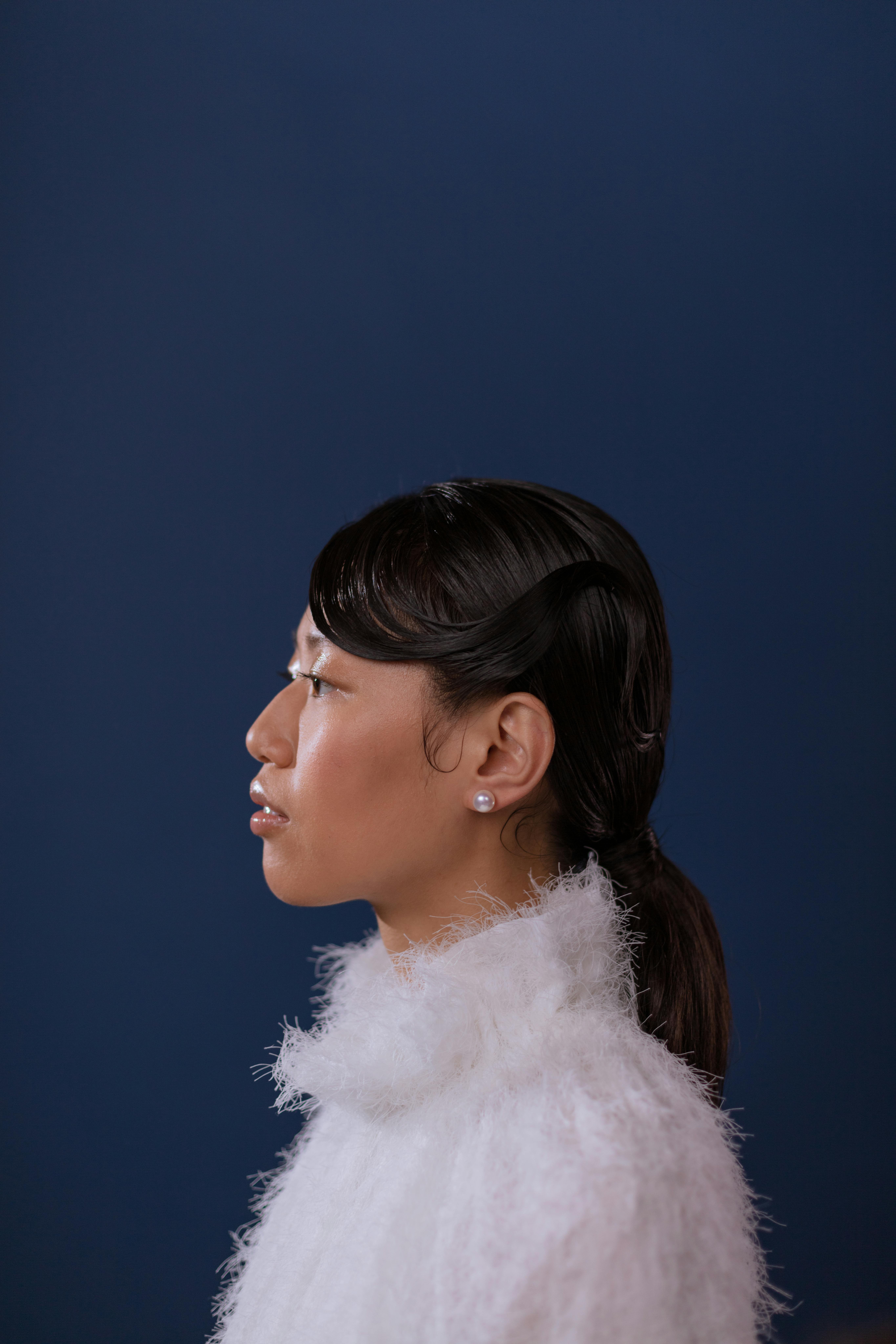 Side Profile of Woman in White Fur Coat · Free Stock Photo