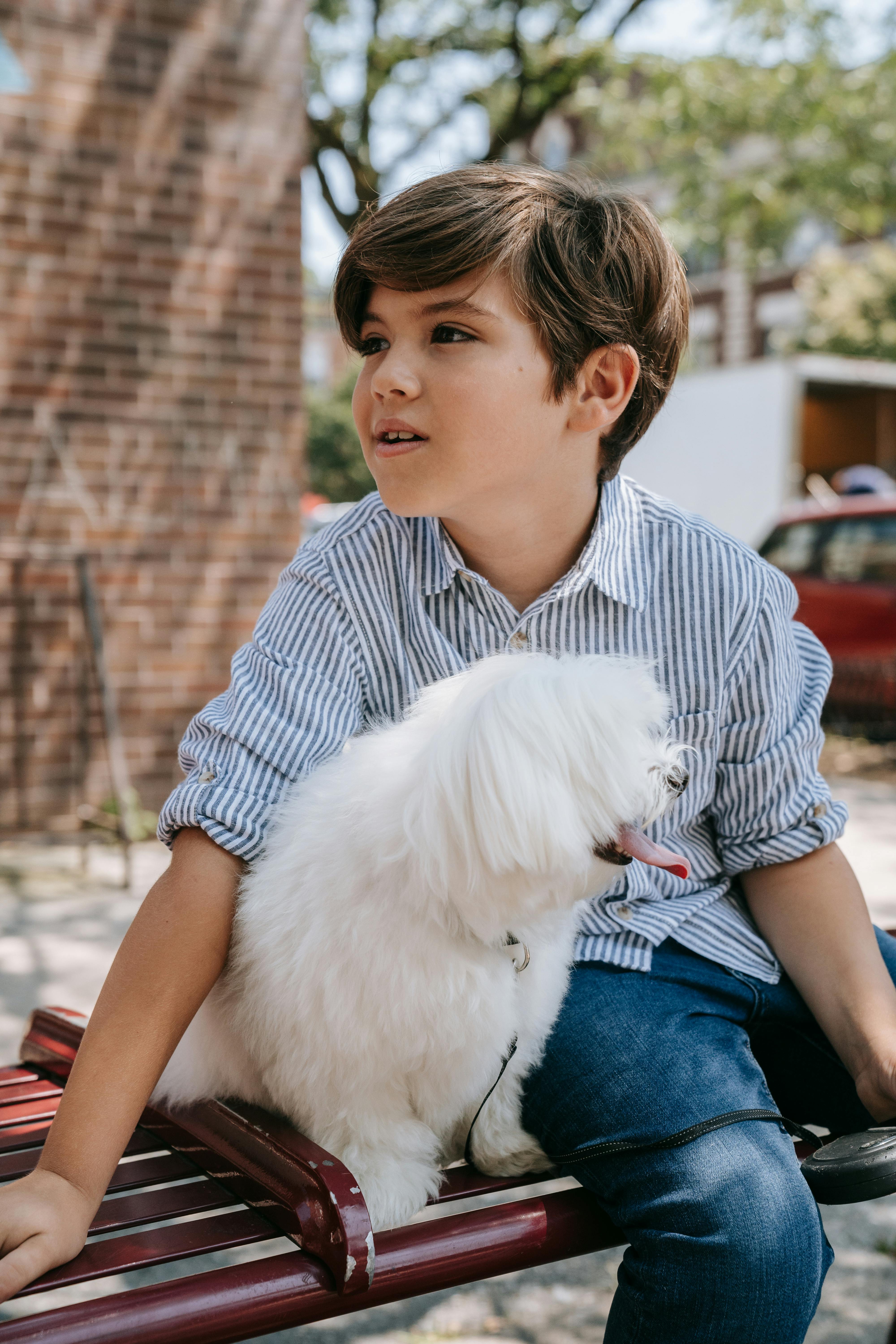 A Boy Sitting with His Pet Dog · Free Stock Photo