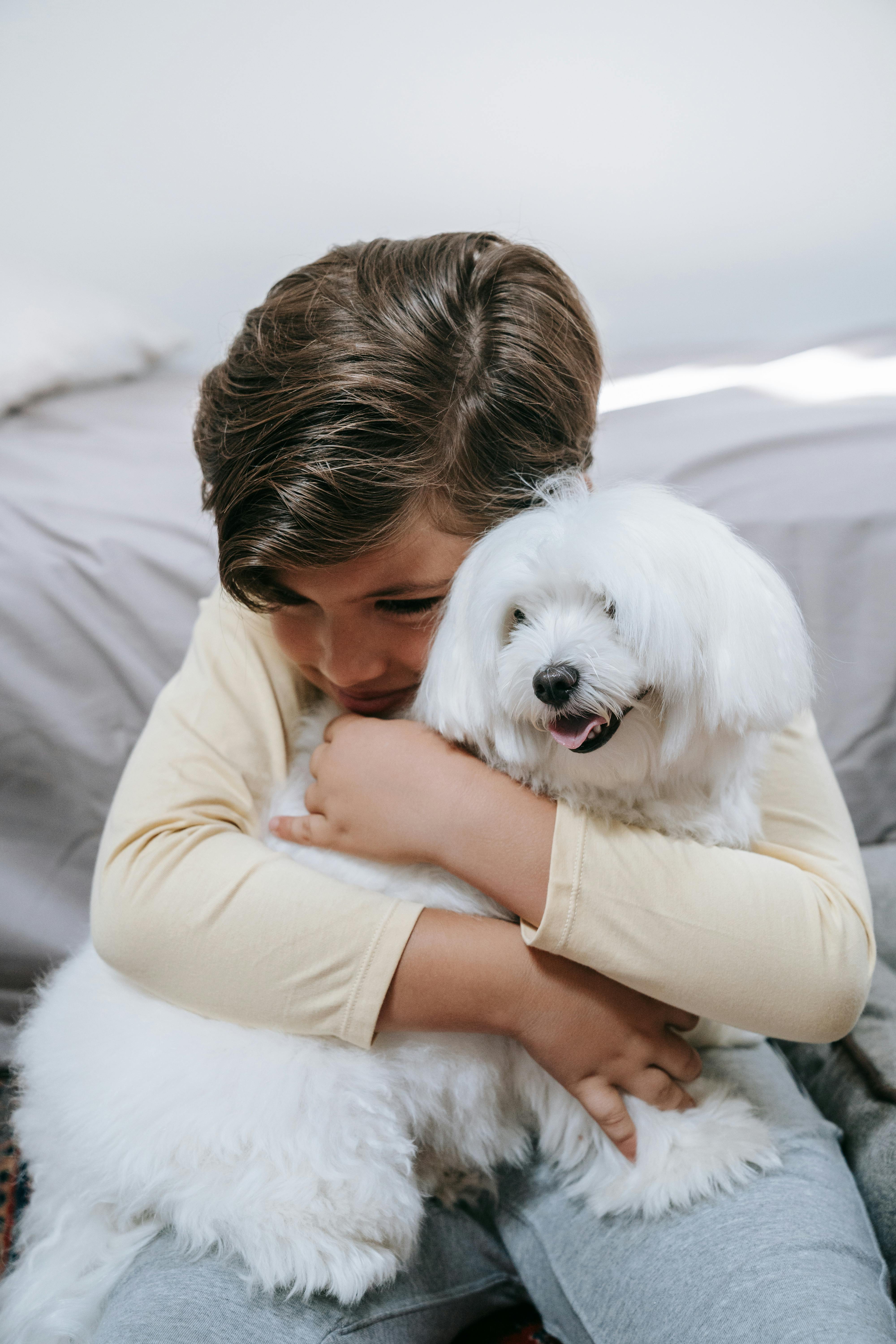 Boy Hugging his Dog · Free Stock Photo