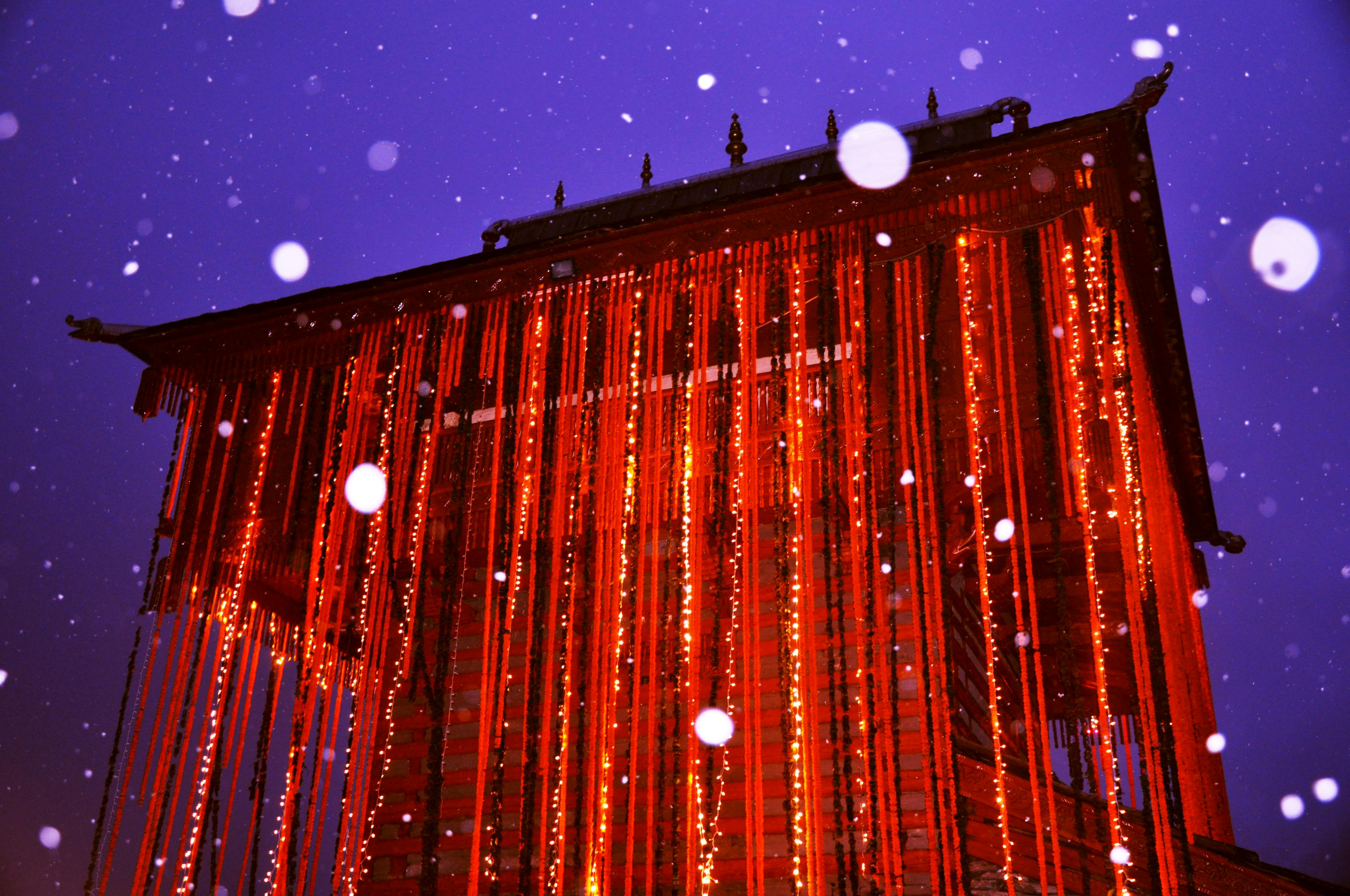 String Lights Hanging Down from the Temple Roof · Free Stock Photo
