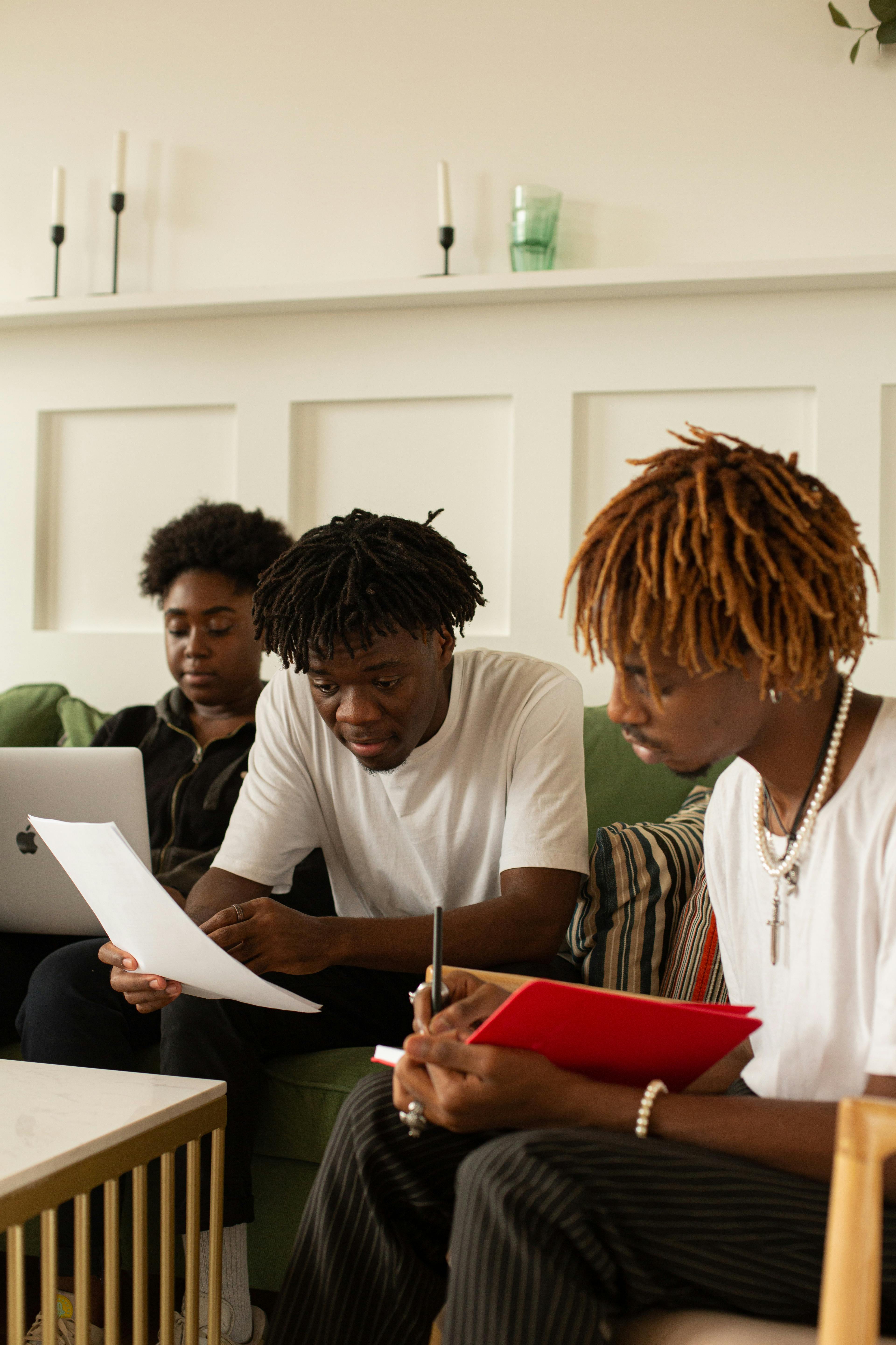 Three People Studying Together · Free Stock Photo