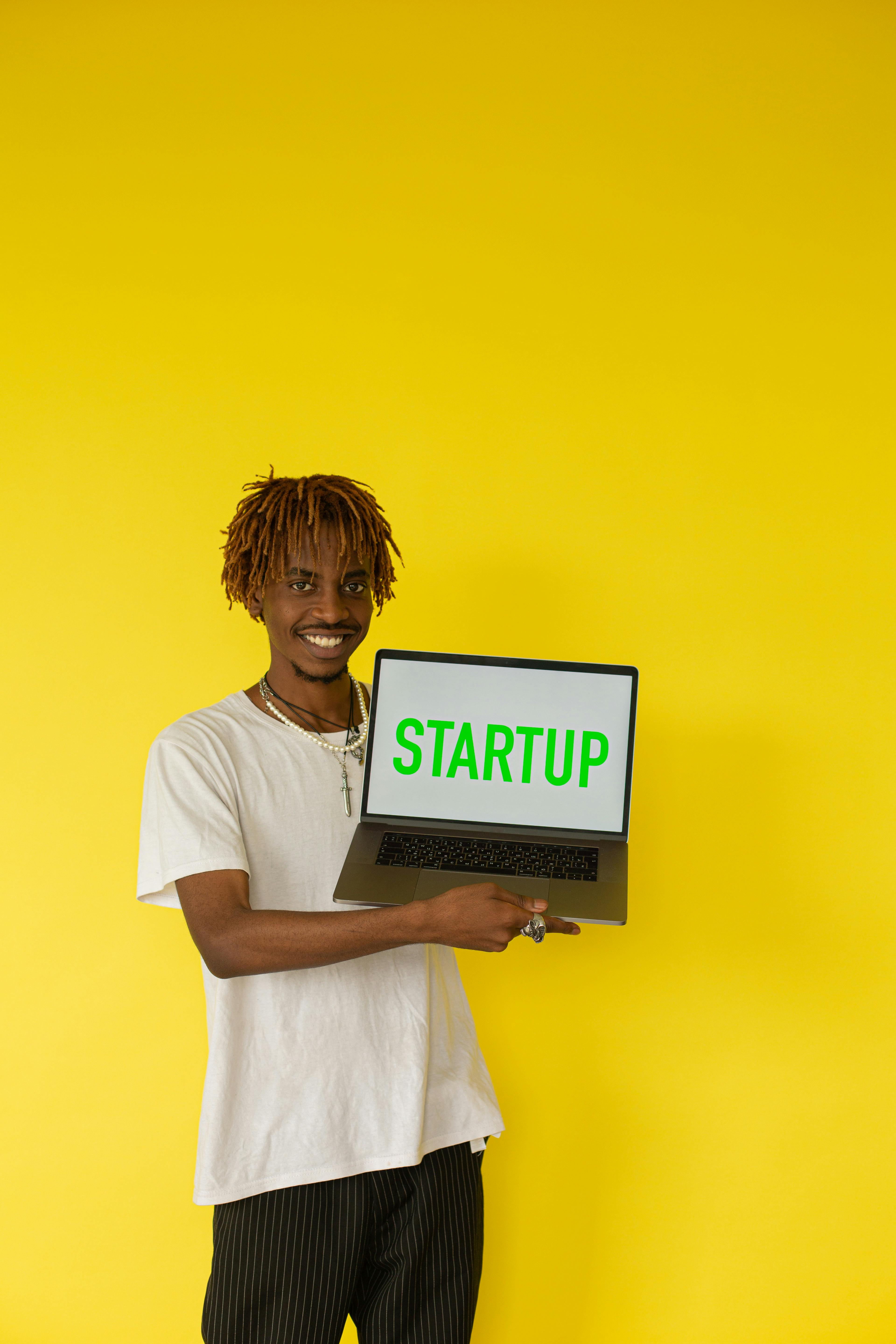 Man carrying a Laptop · Free Stock Photo