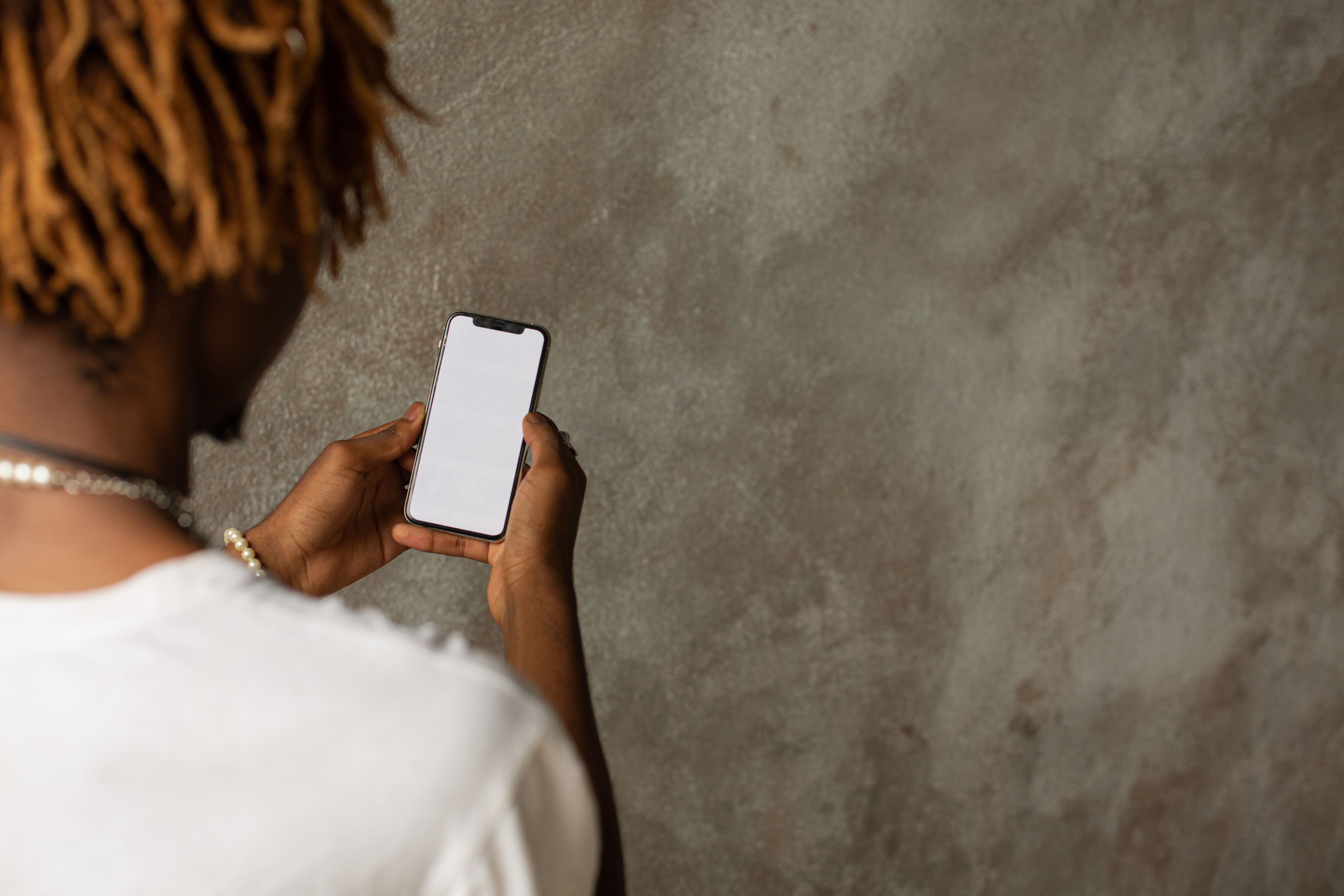 A Smartphone with Blank Screen on Gray Surface · Free Stock Photo