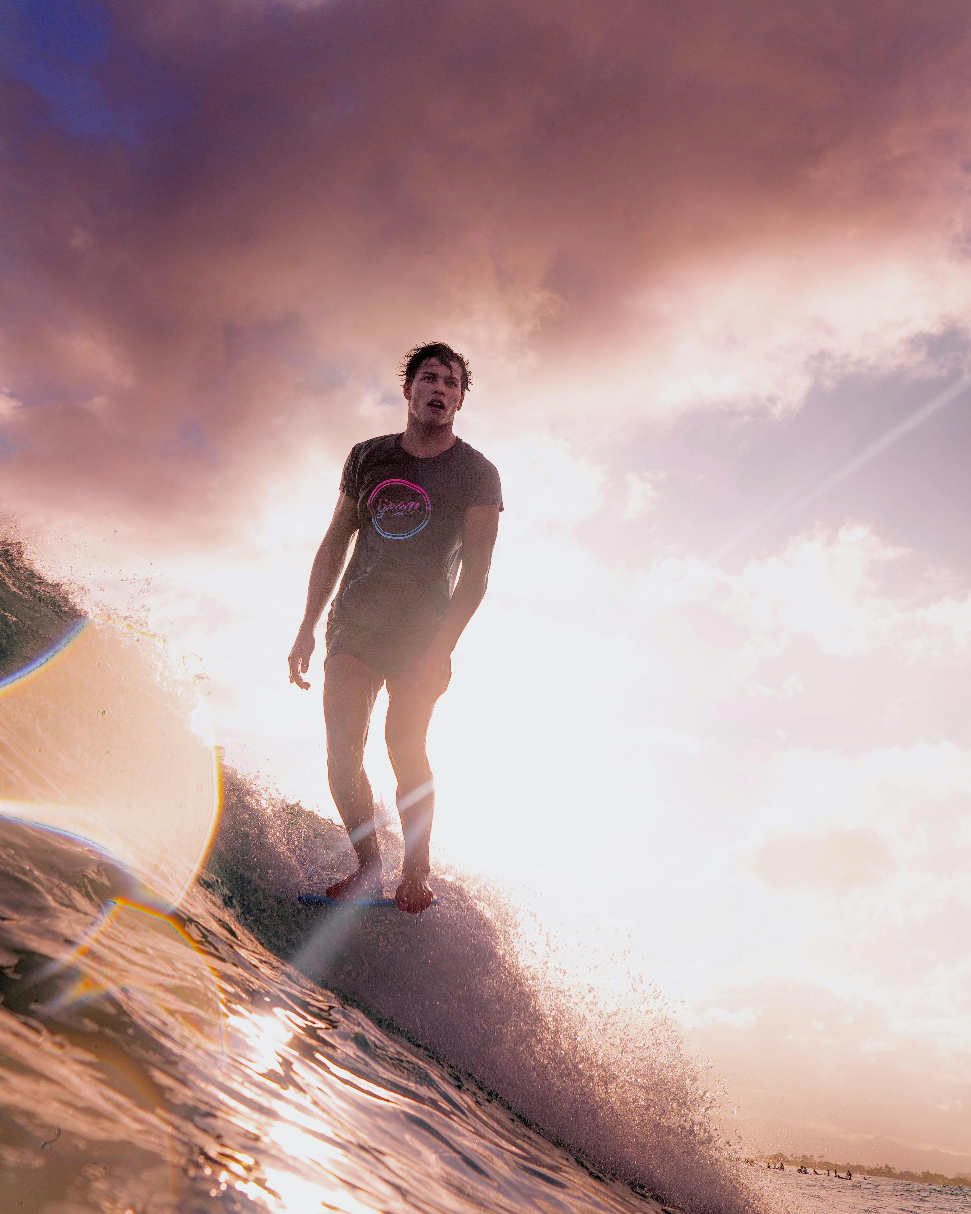Woman riding Surfboard · Free Stock Photo