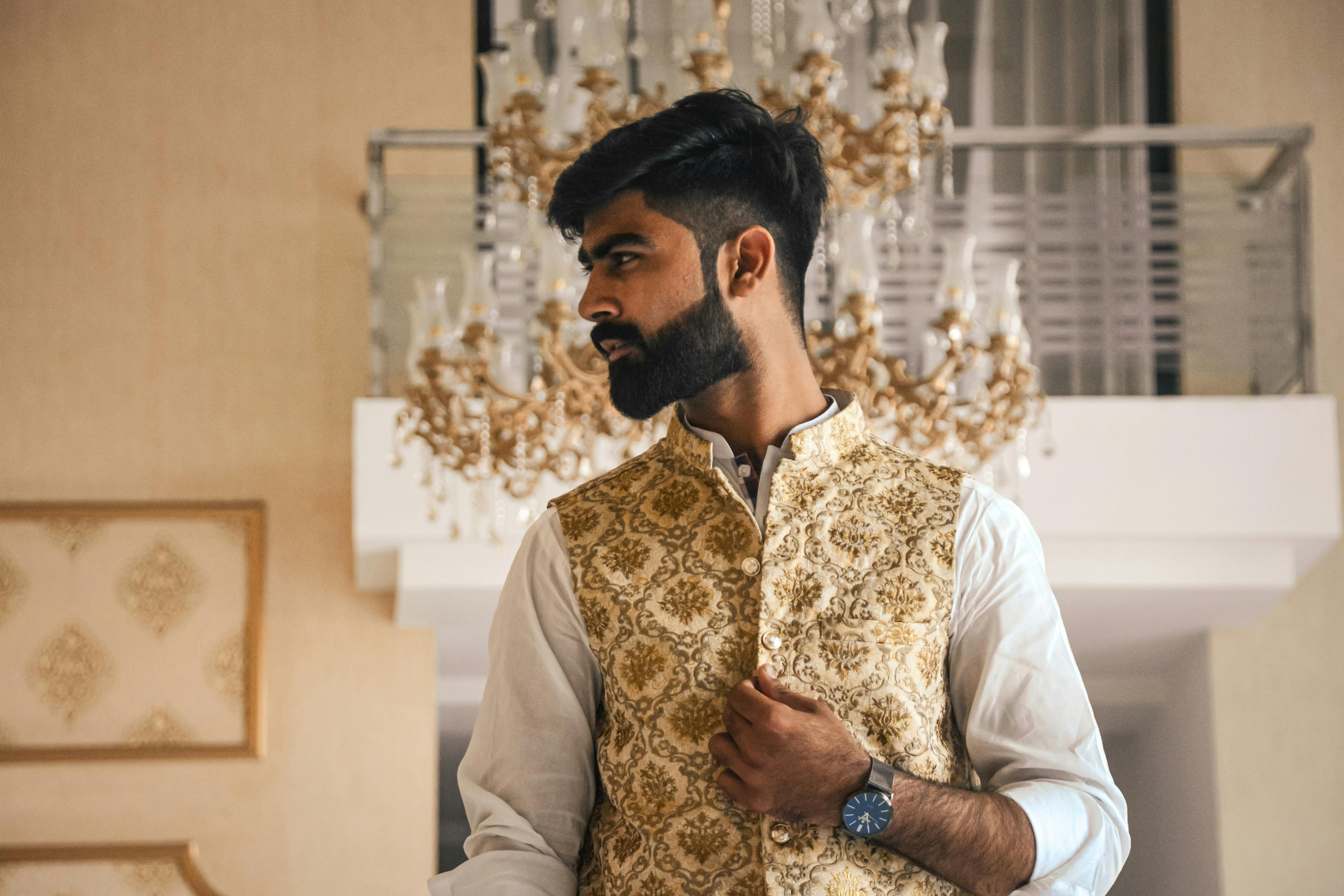 Man in Traditional Clothing Looking Sideways · Free Stock Photo