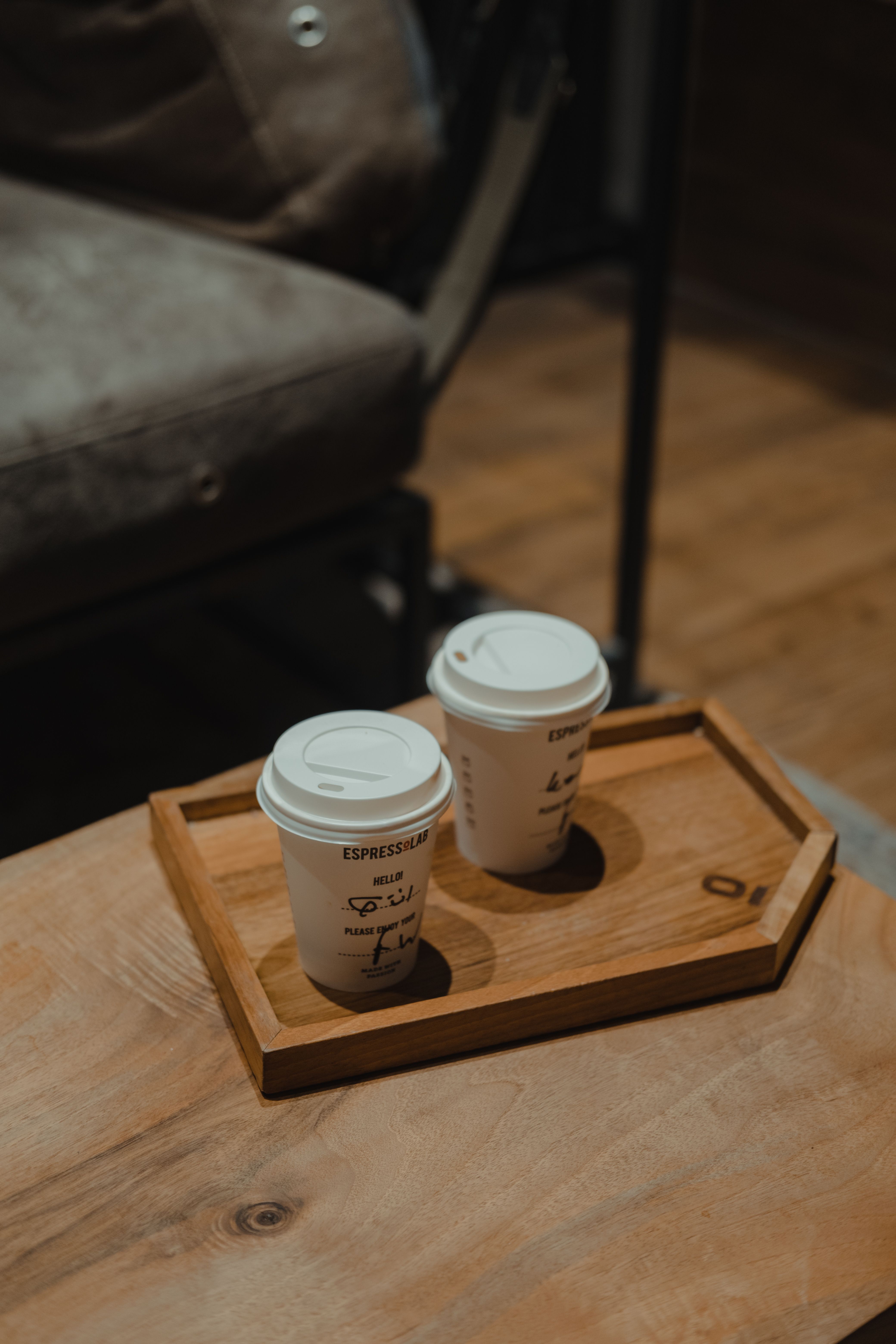 A Coffee Cup and a Wooden Box Tray on a Table · Free Stock Photo