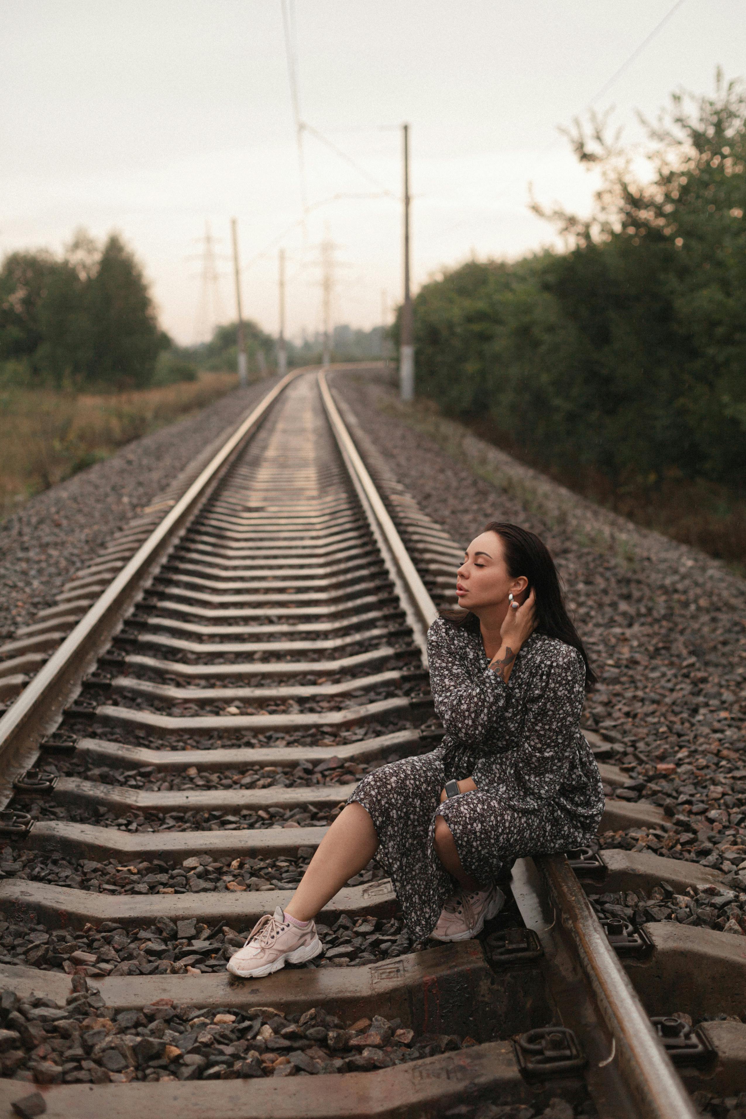 Woman Standing on Railroad · Free Stock Photo