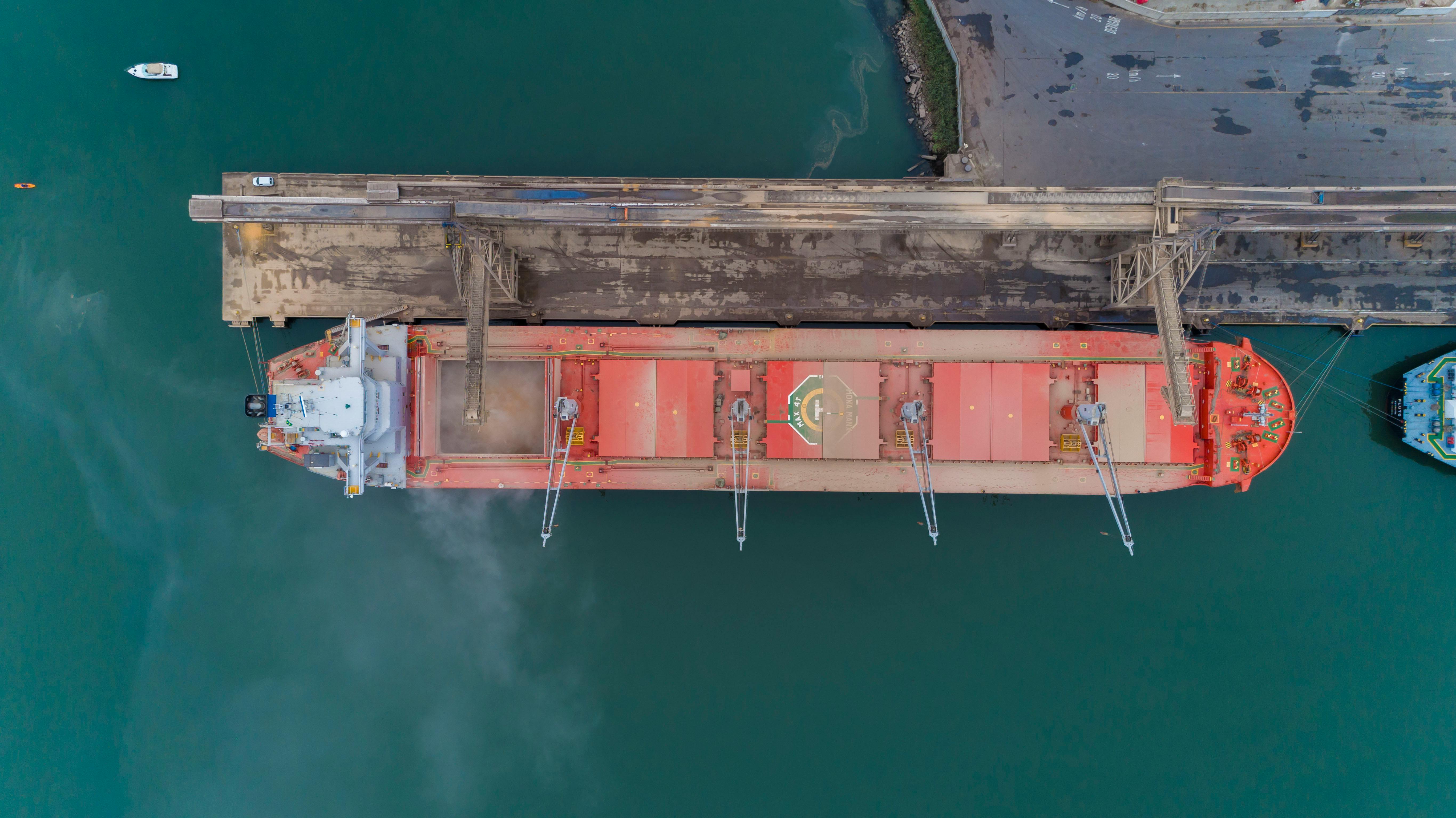 Aerial View of Red Ship on Dock · Free Stock Photo