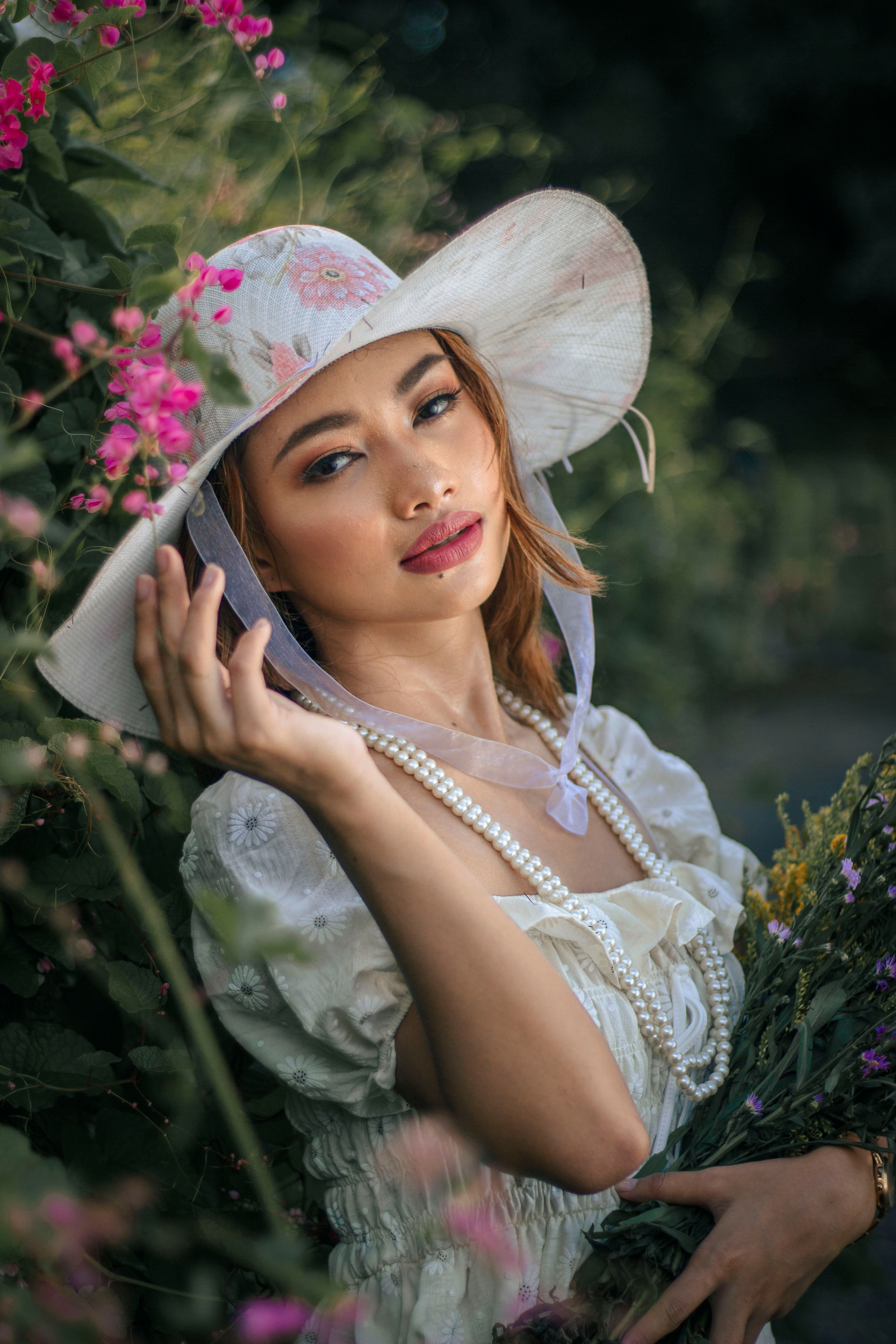 A Woman Wearing White Hat · Free Stock Photo