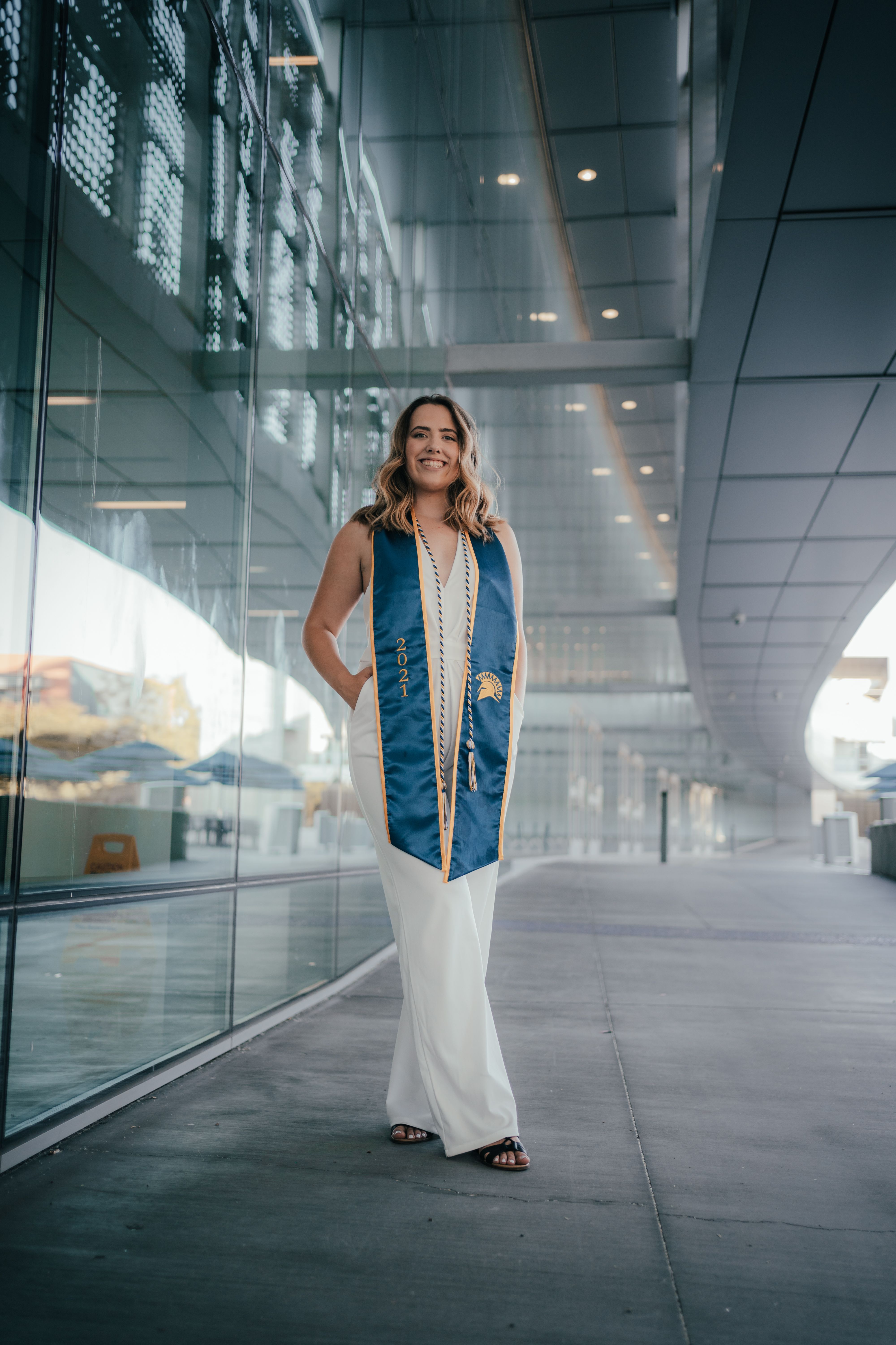Woman with a Sash Standing on a Walkway · Free Stock Photo