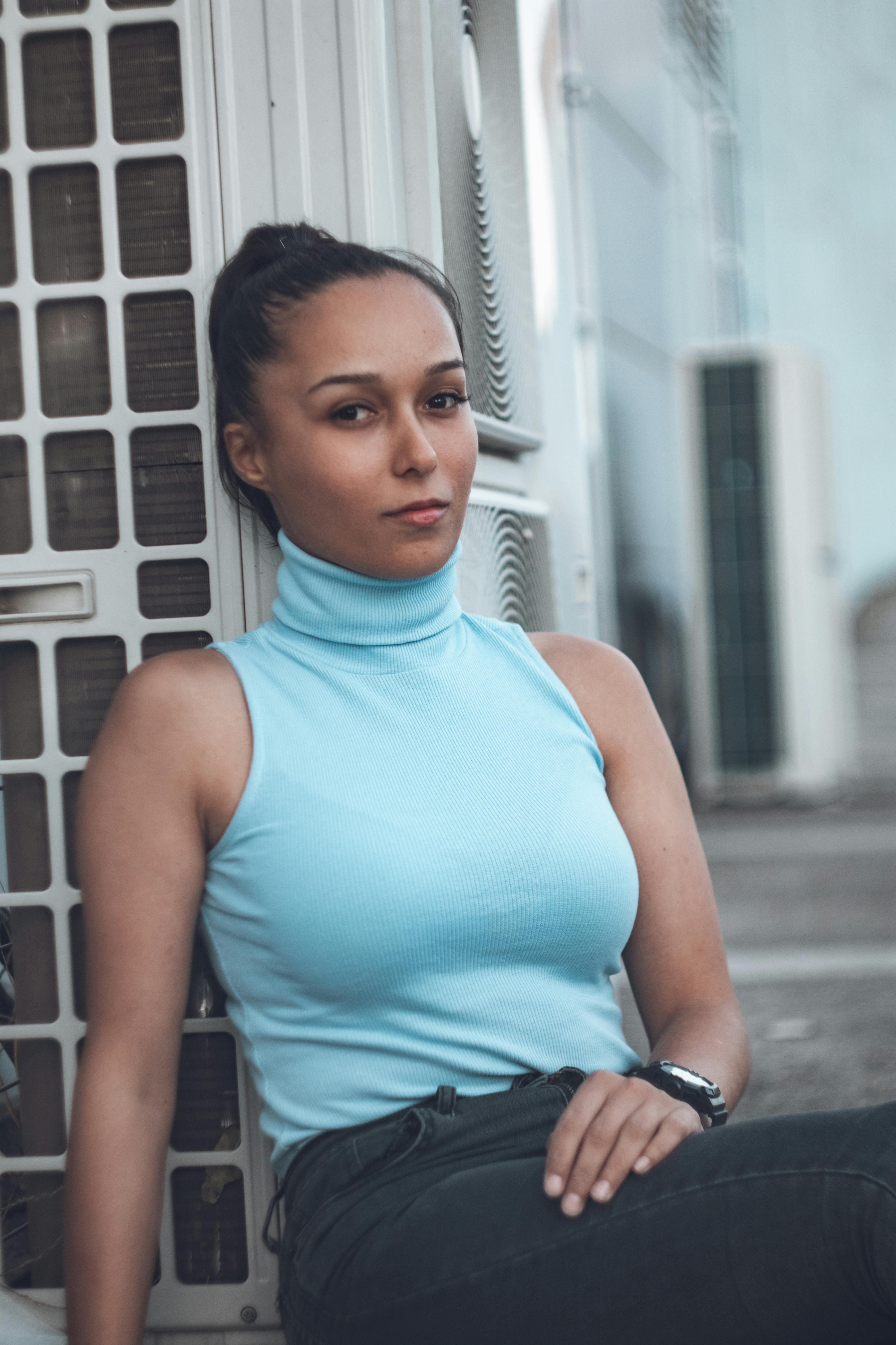 A Woman Wearing a Sleeveless Blue Top · Free Stock Photo