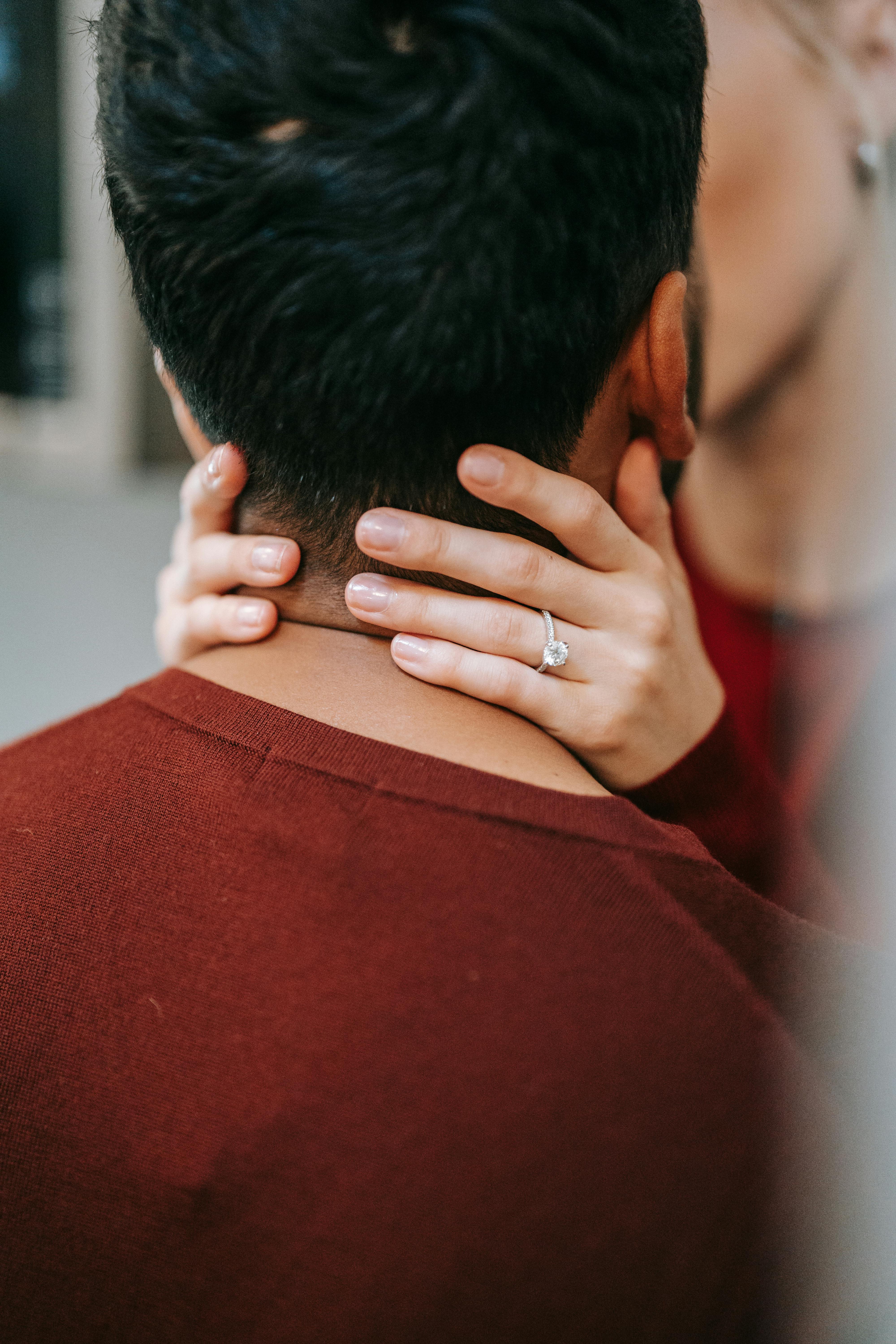 Hands on a Man's Neck · Free Stock Photo