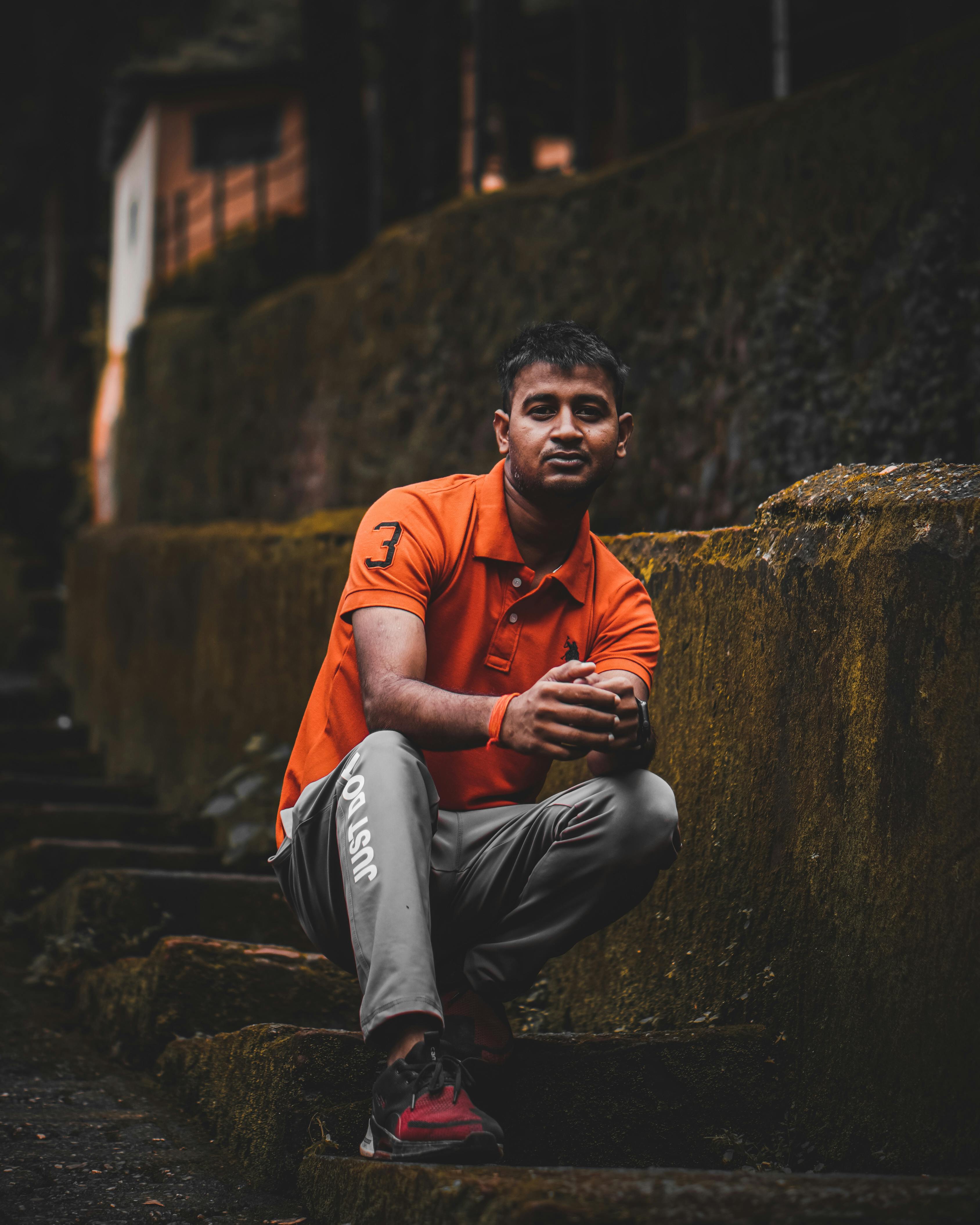 A Man Wearing an Orange Shirt · Free Stock Photo