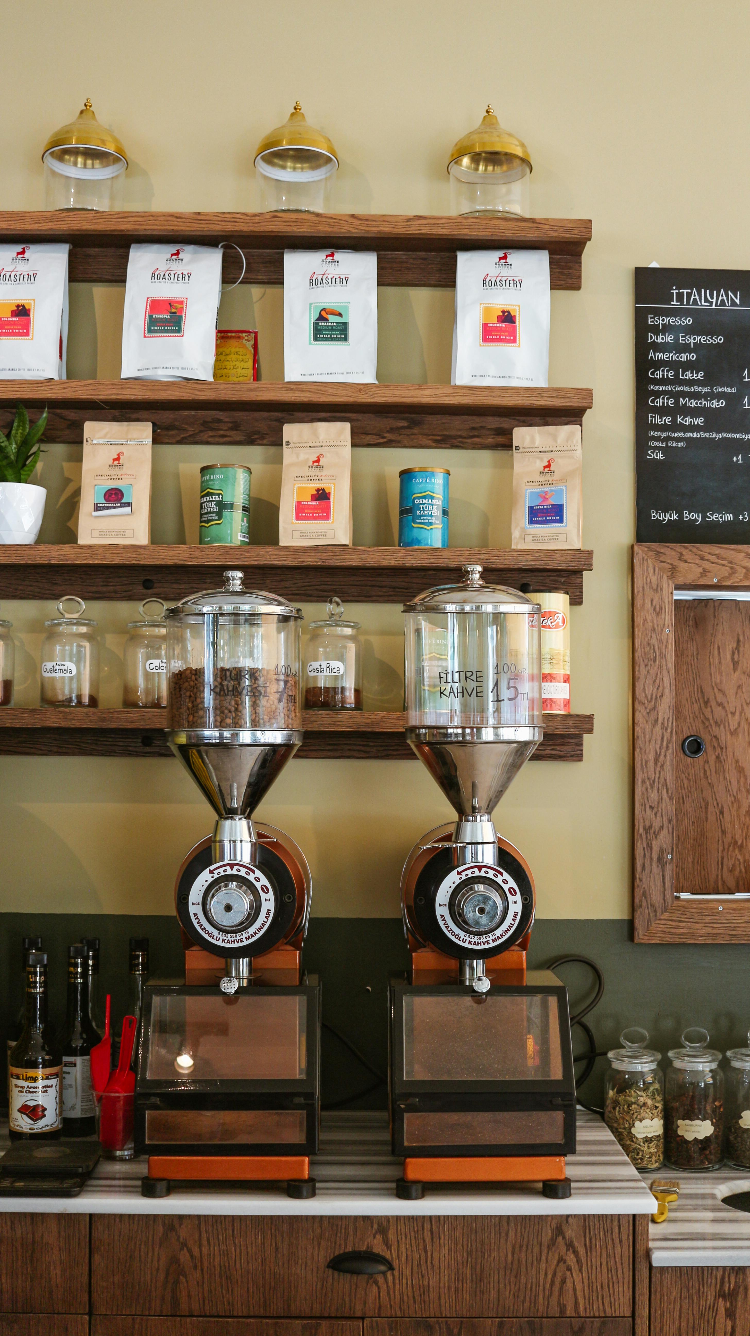 Pack of Coffee Beans Display on a Brown Wooden Shelves · Free Stock Photo