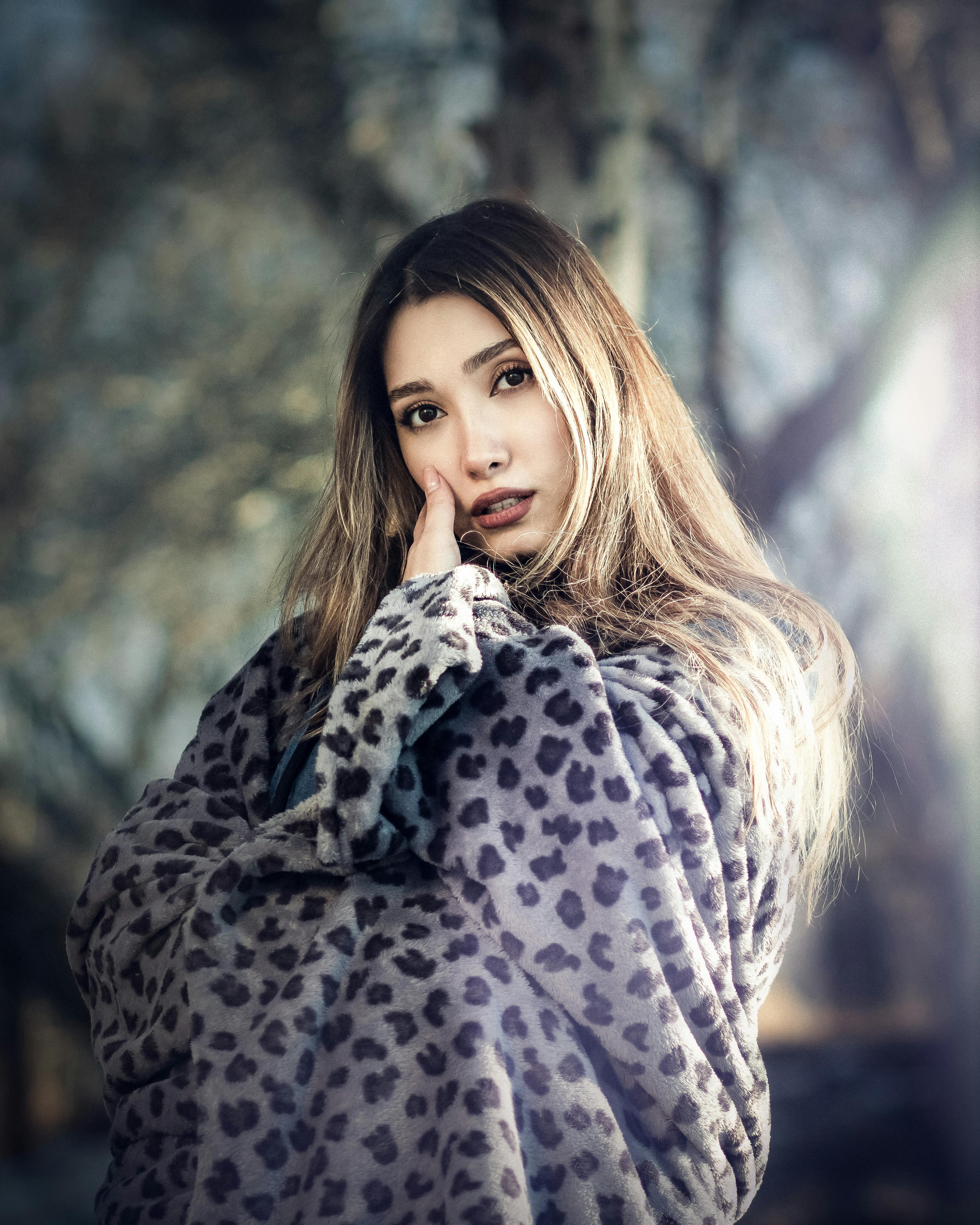 Woman in Black and White Leopard Print Coat · Free Stock Photo