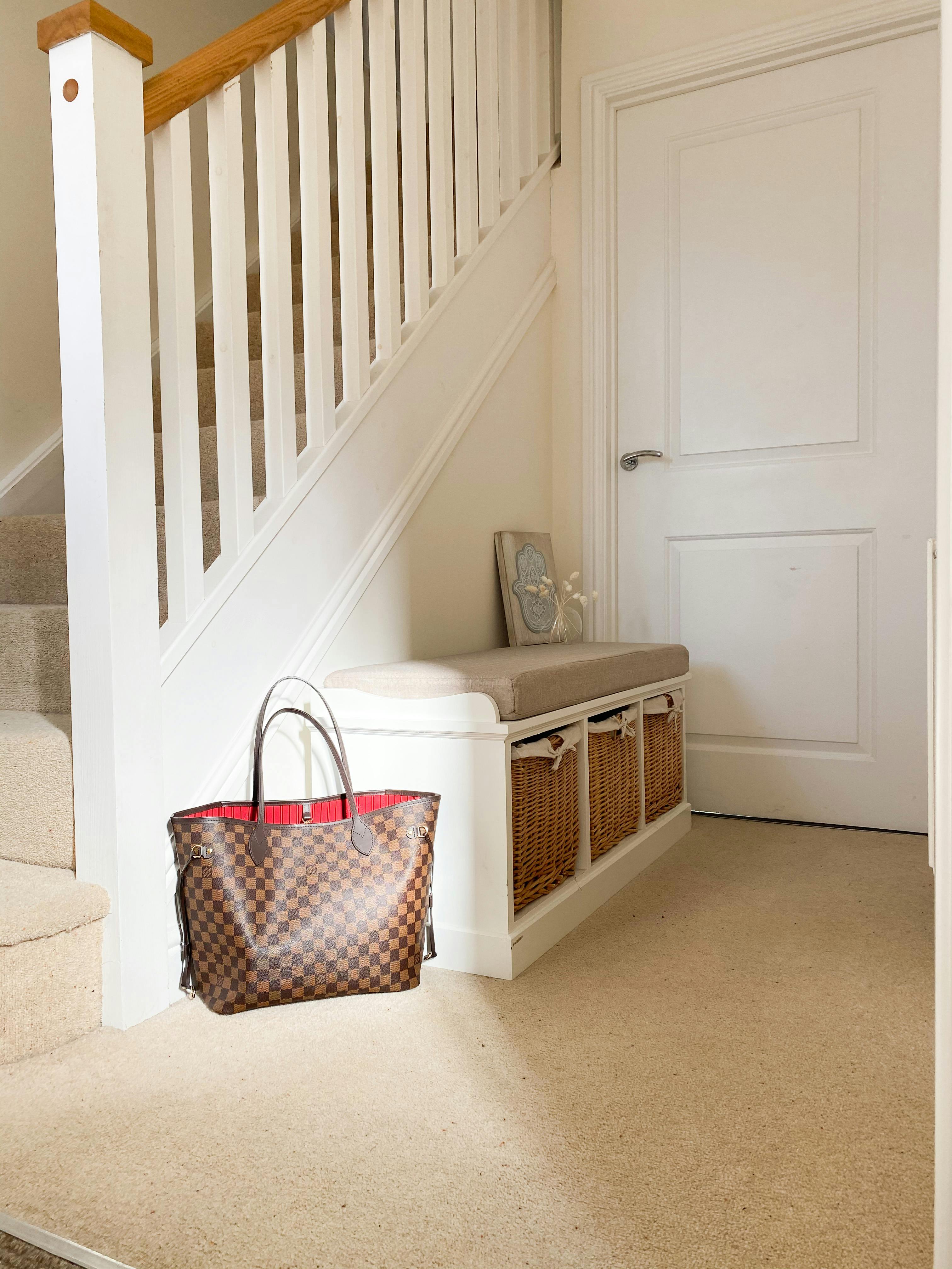 Storage Bench with Wicker Basket Against a Staircase Wall · Free Stock ...