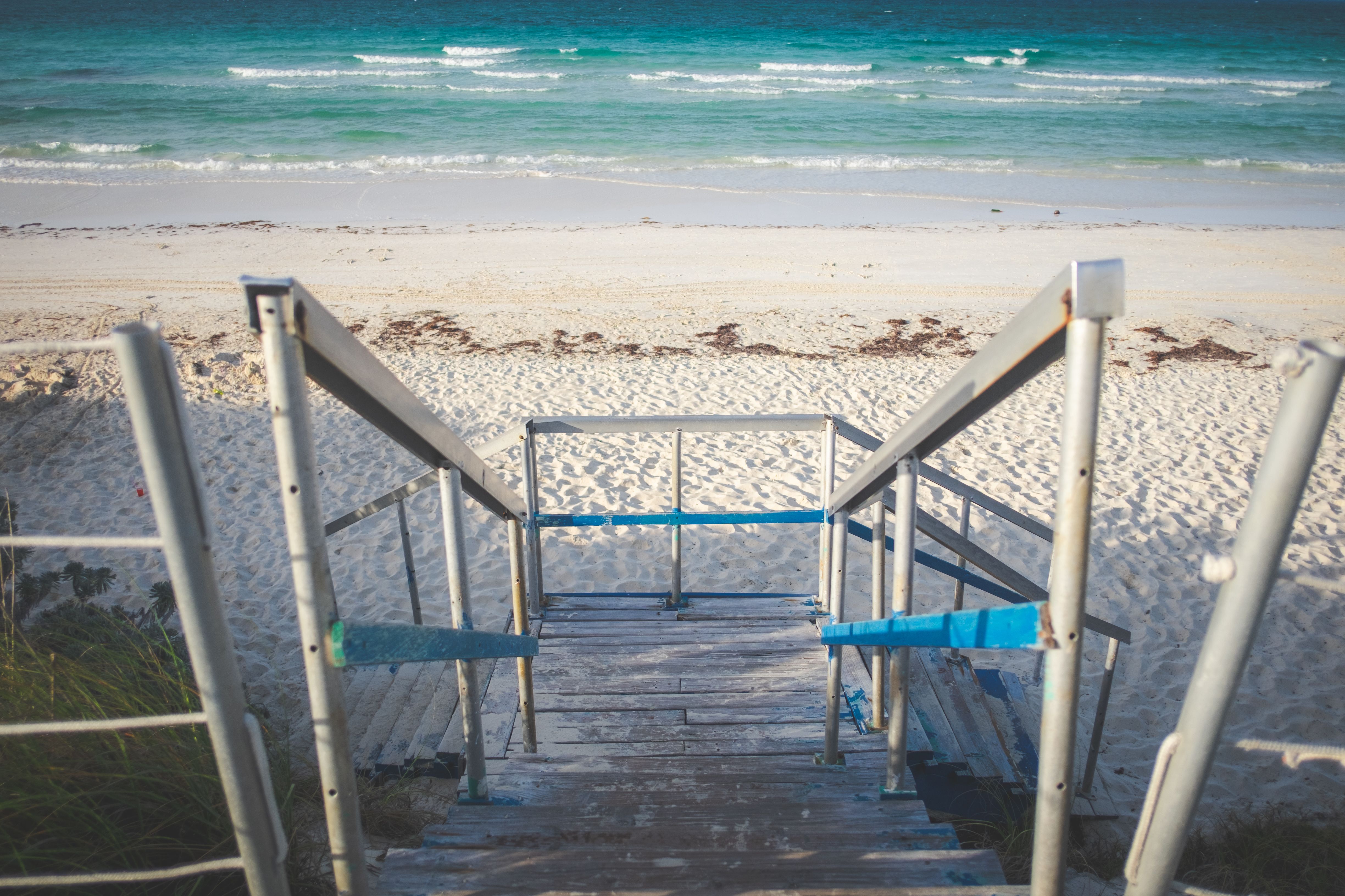 Wooden Stairs with Metal Railing on a Beach · Free Stock Photo