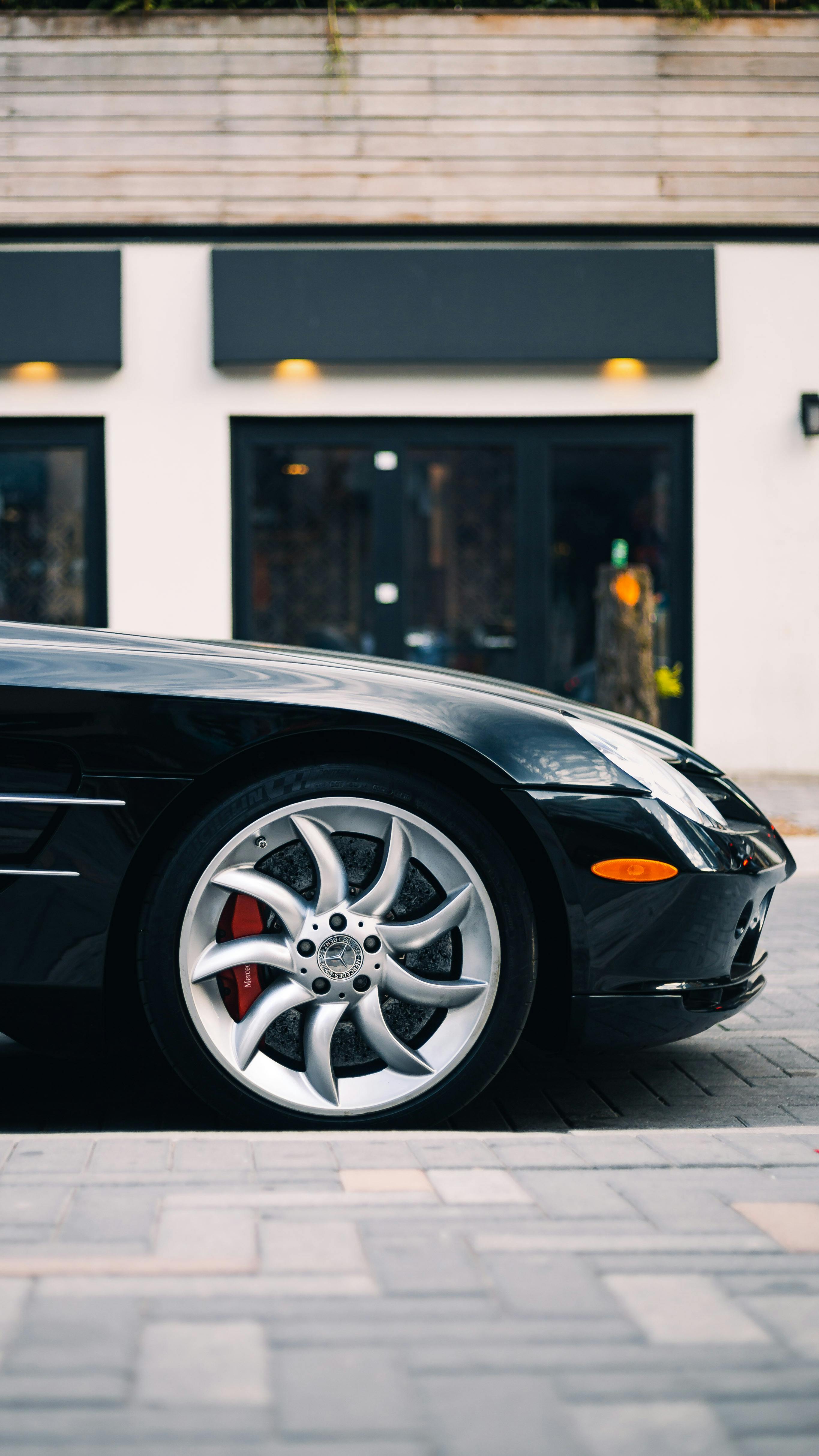 Wheel of a Black Car on the Road Side · Free Stock Photo